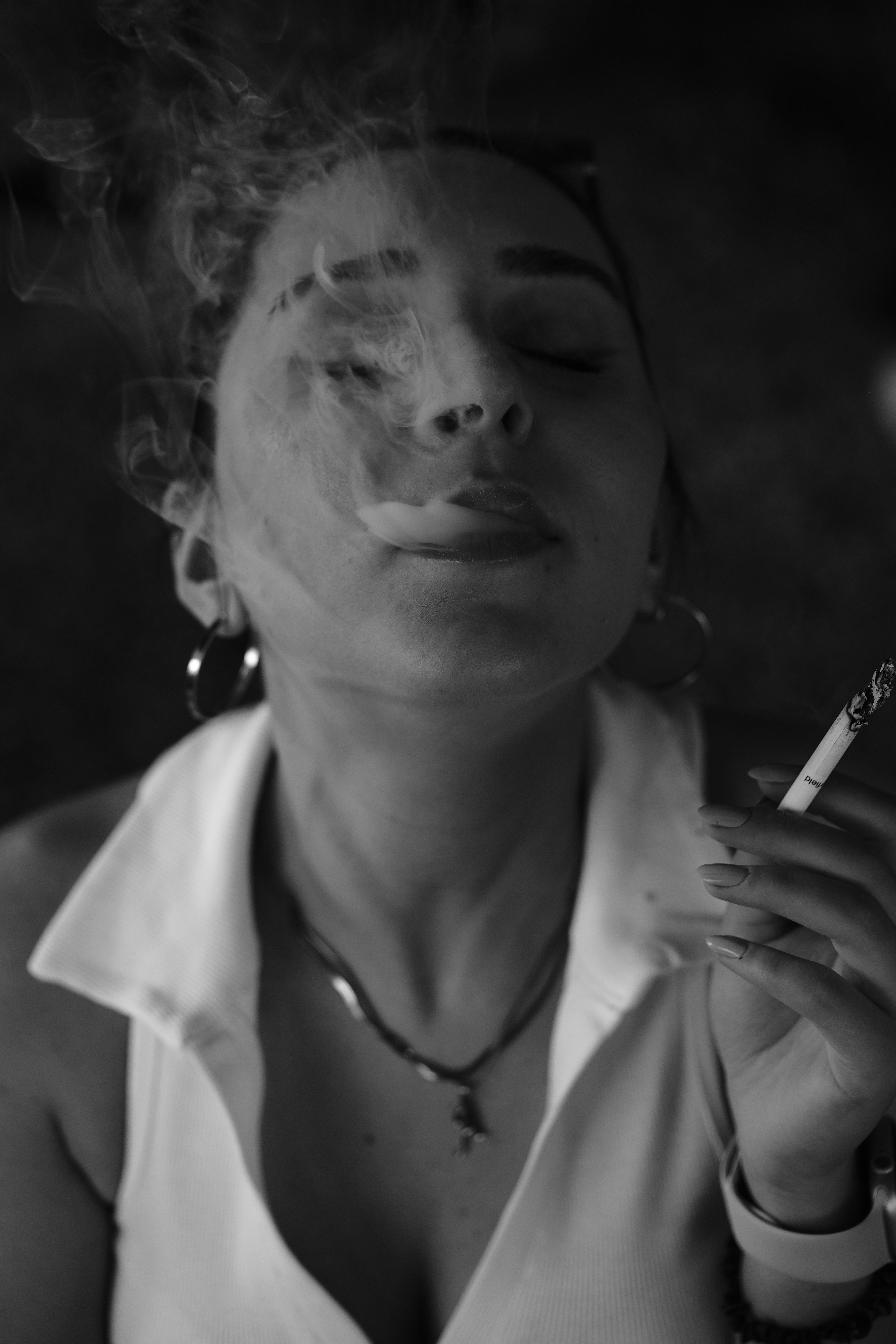 Woman Smoking a Cigarette in Black and White · Free Stock Photo