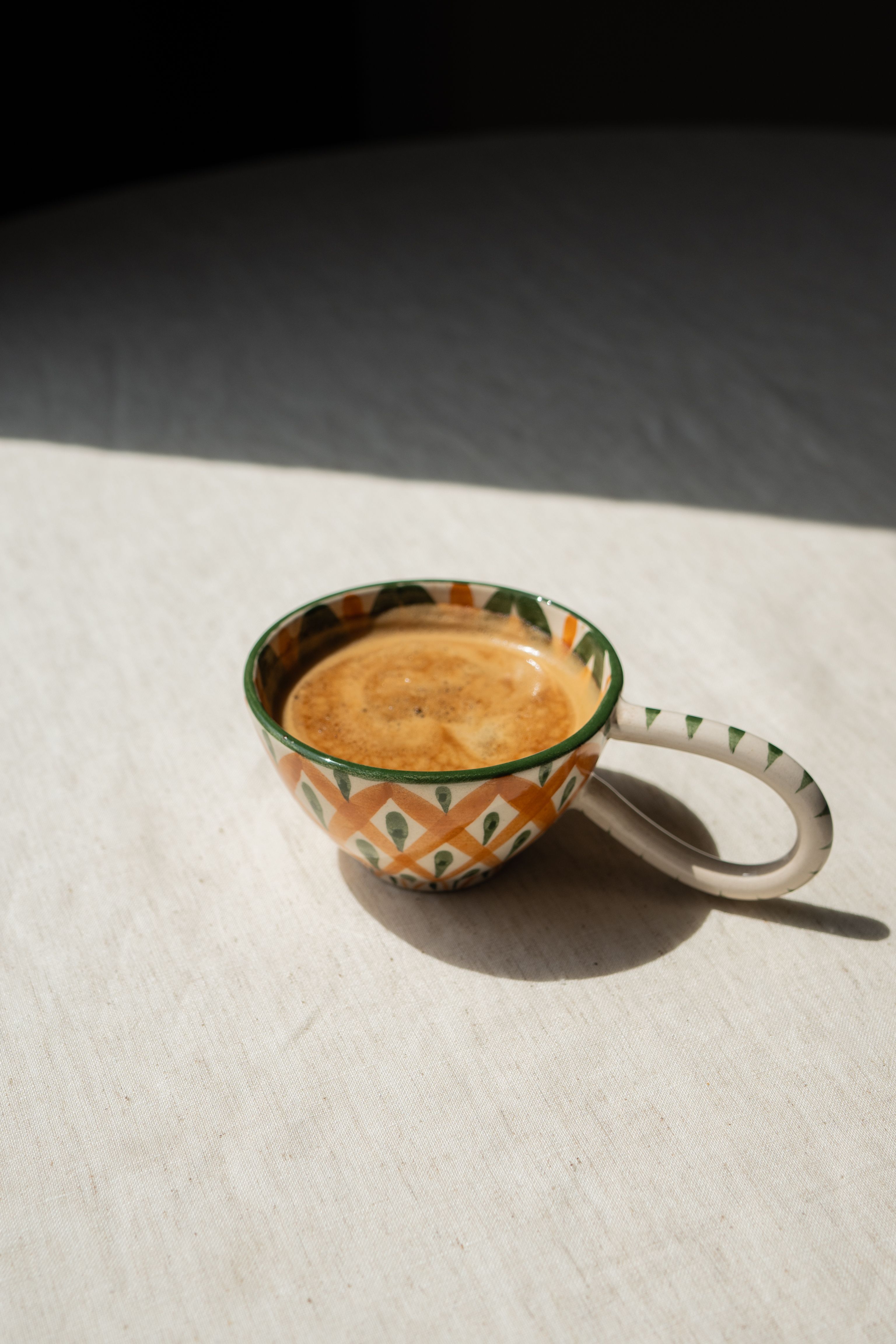 Elegant Espresso Cup in Sunlight · Free Stock Photo