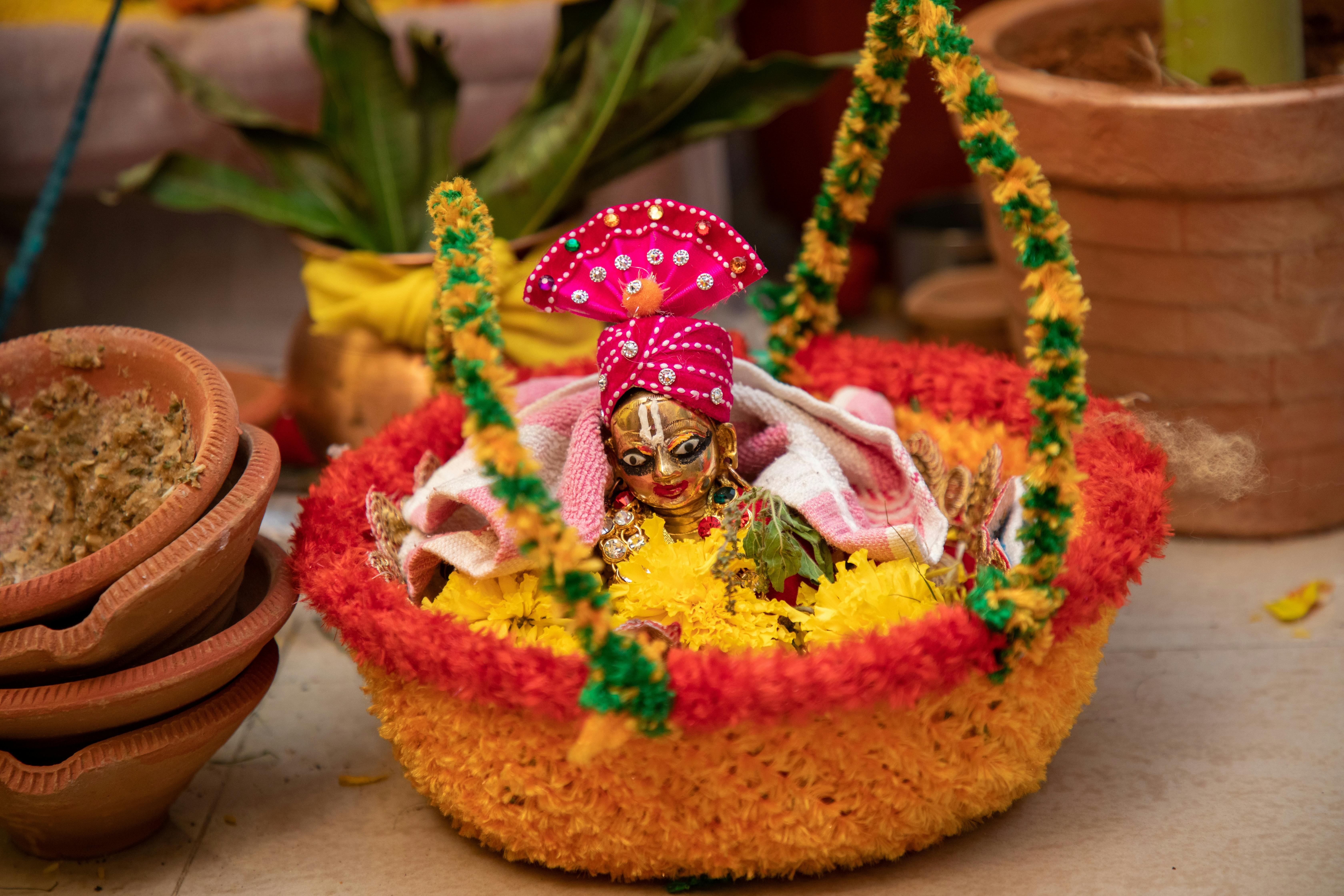 A Hindu Puppet in a Basket Decorated with Flowers · Free Stock Photo