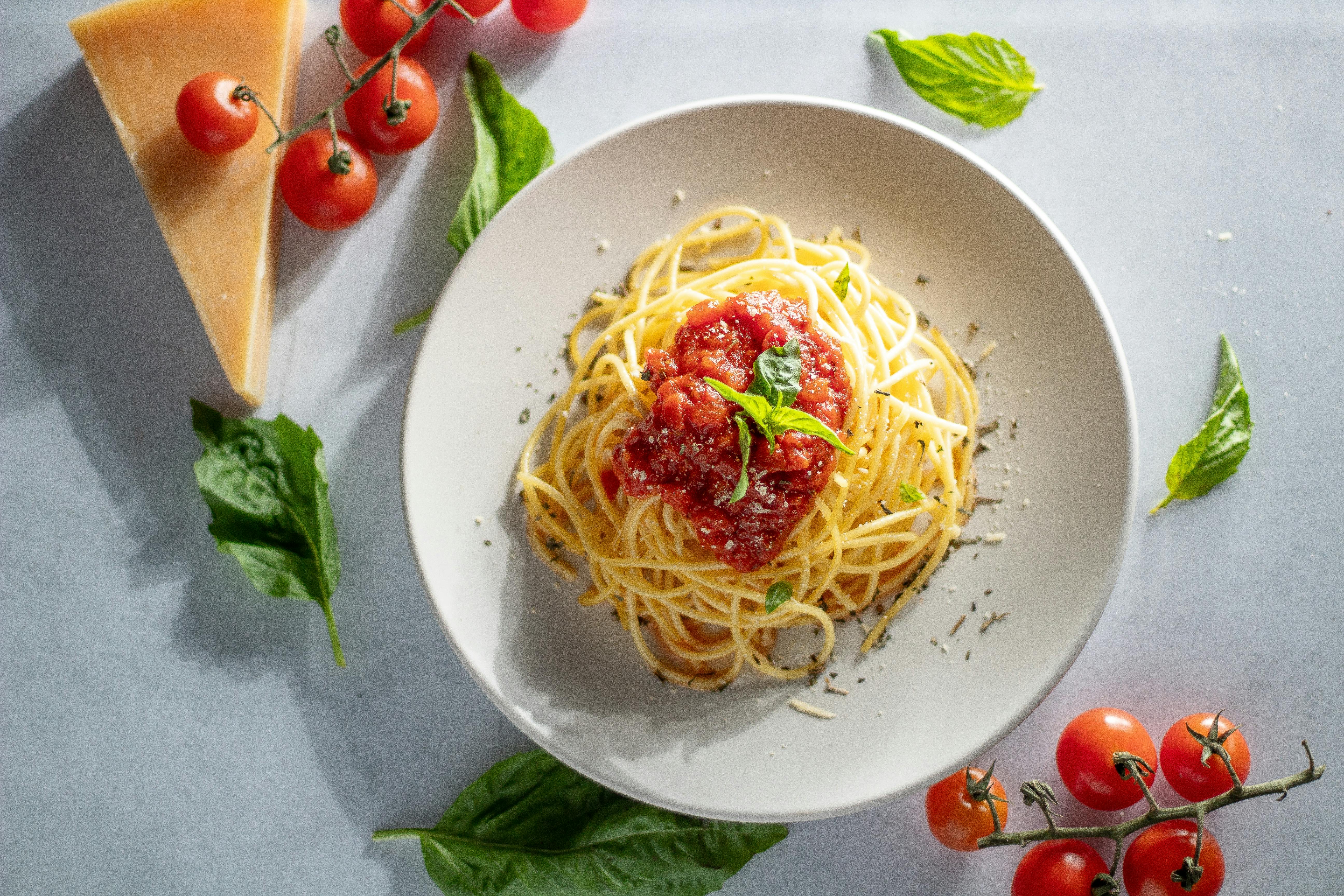 Top View of Spaghetti Pasta with Tomato Sauce · Free Stock Photo