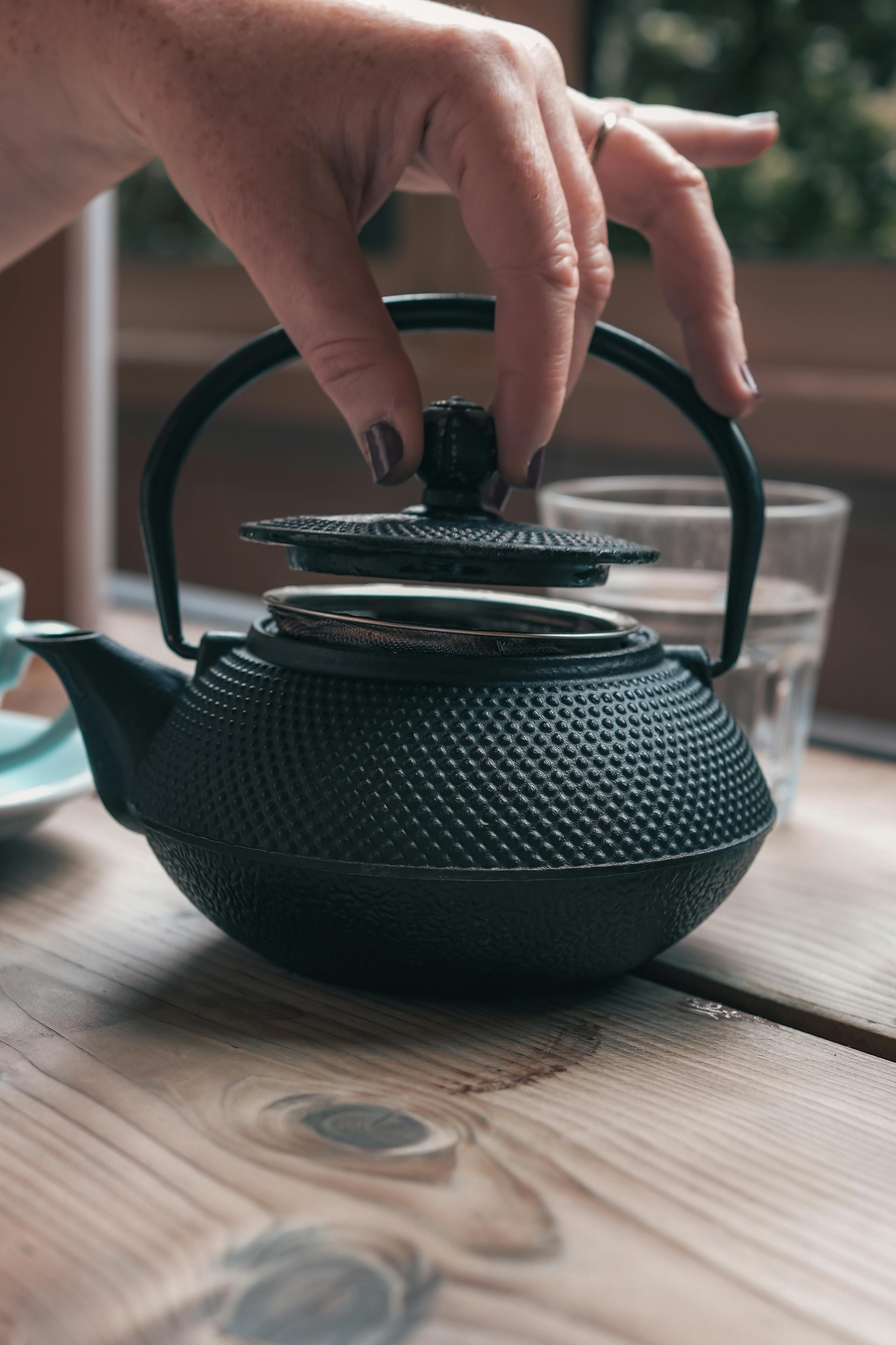 Woman Hand Holding Kettle Cap · Free Stock Photo