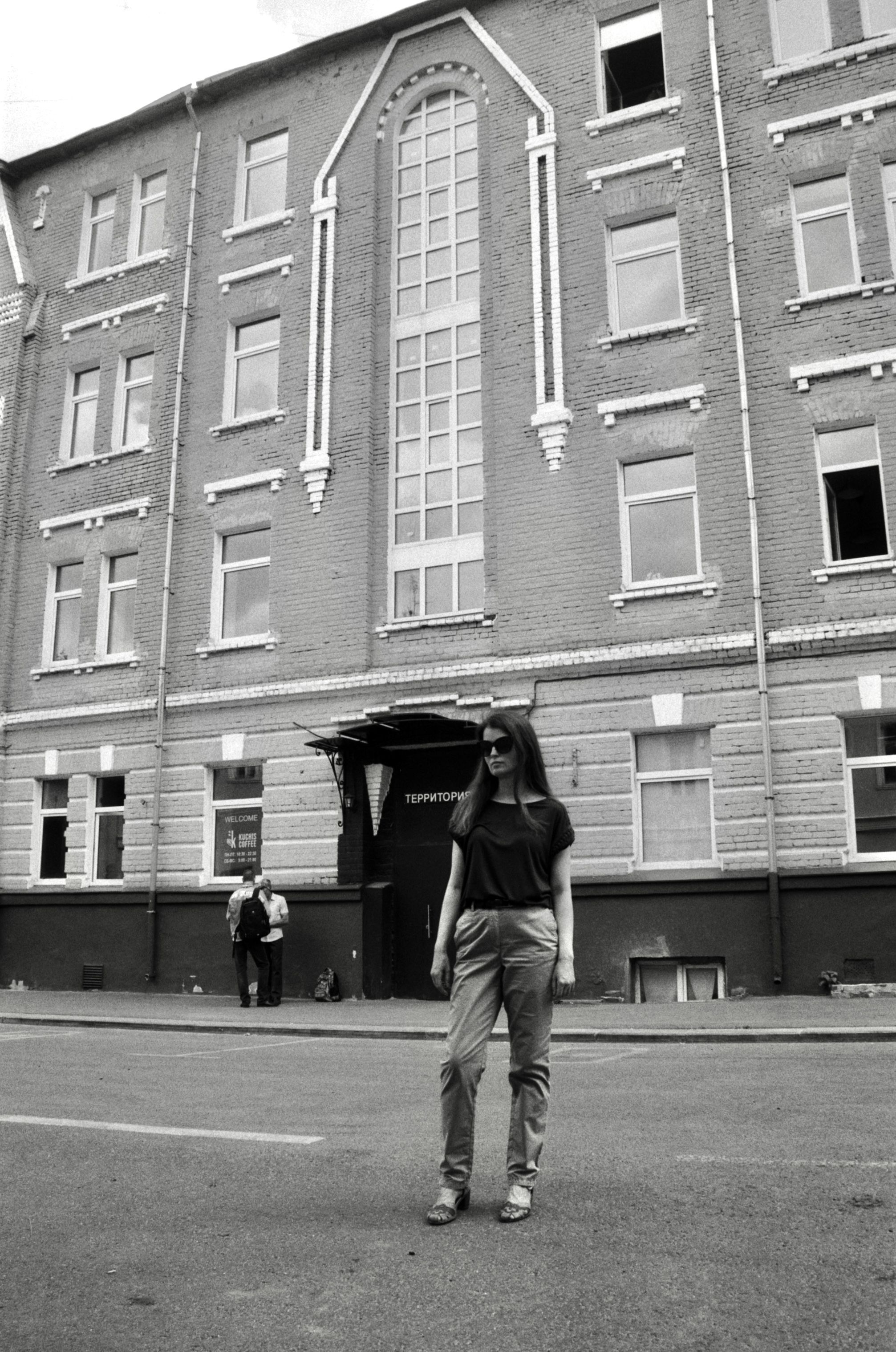 Woman Standing in Front of a Traditional Tenement in Black and White ...