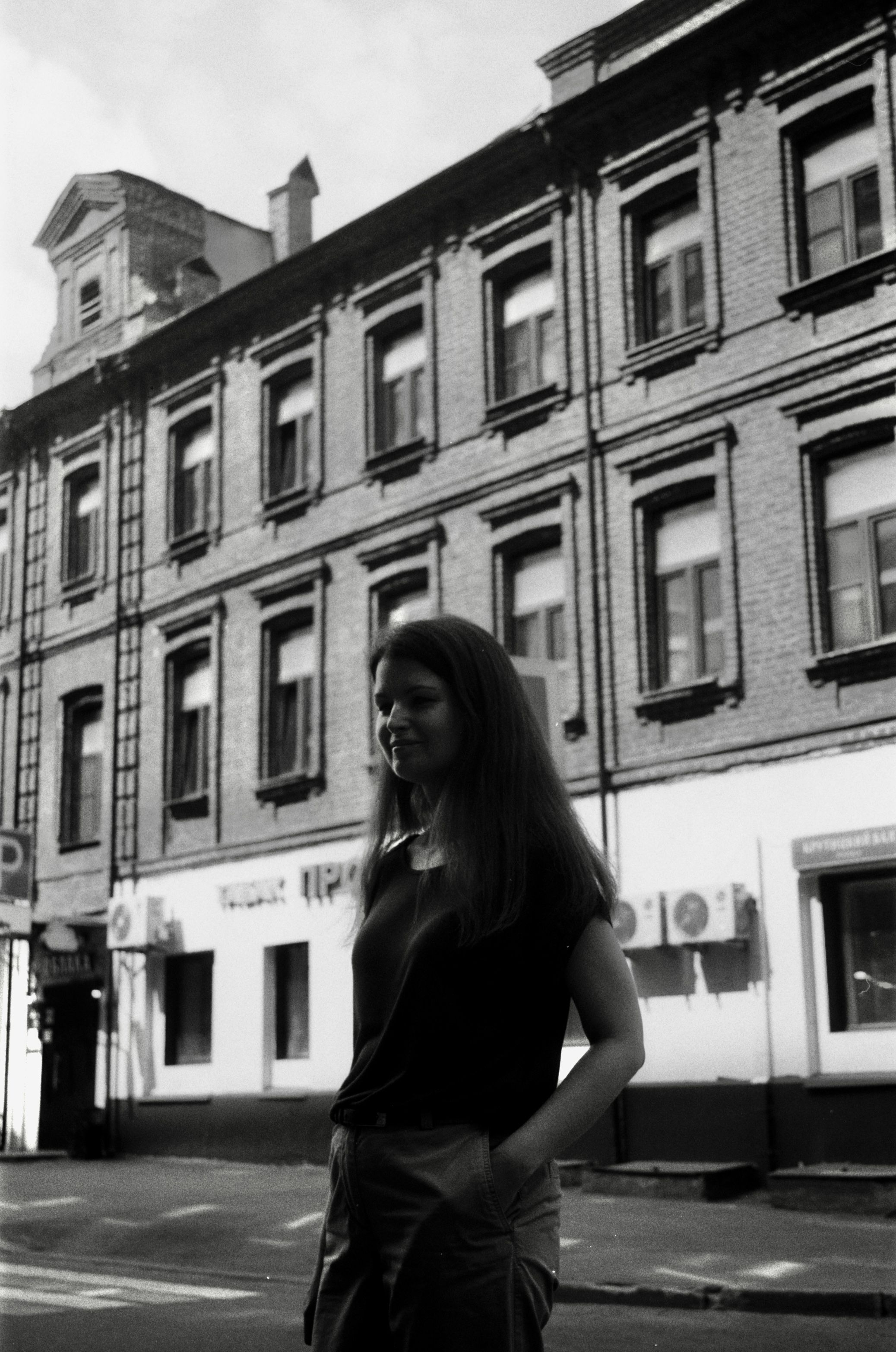 Woman Walking in front of Traditional Tenement · Free Stock Photo