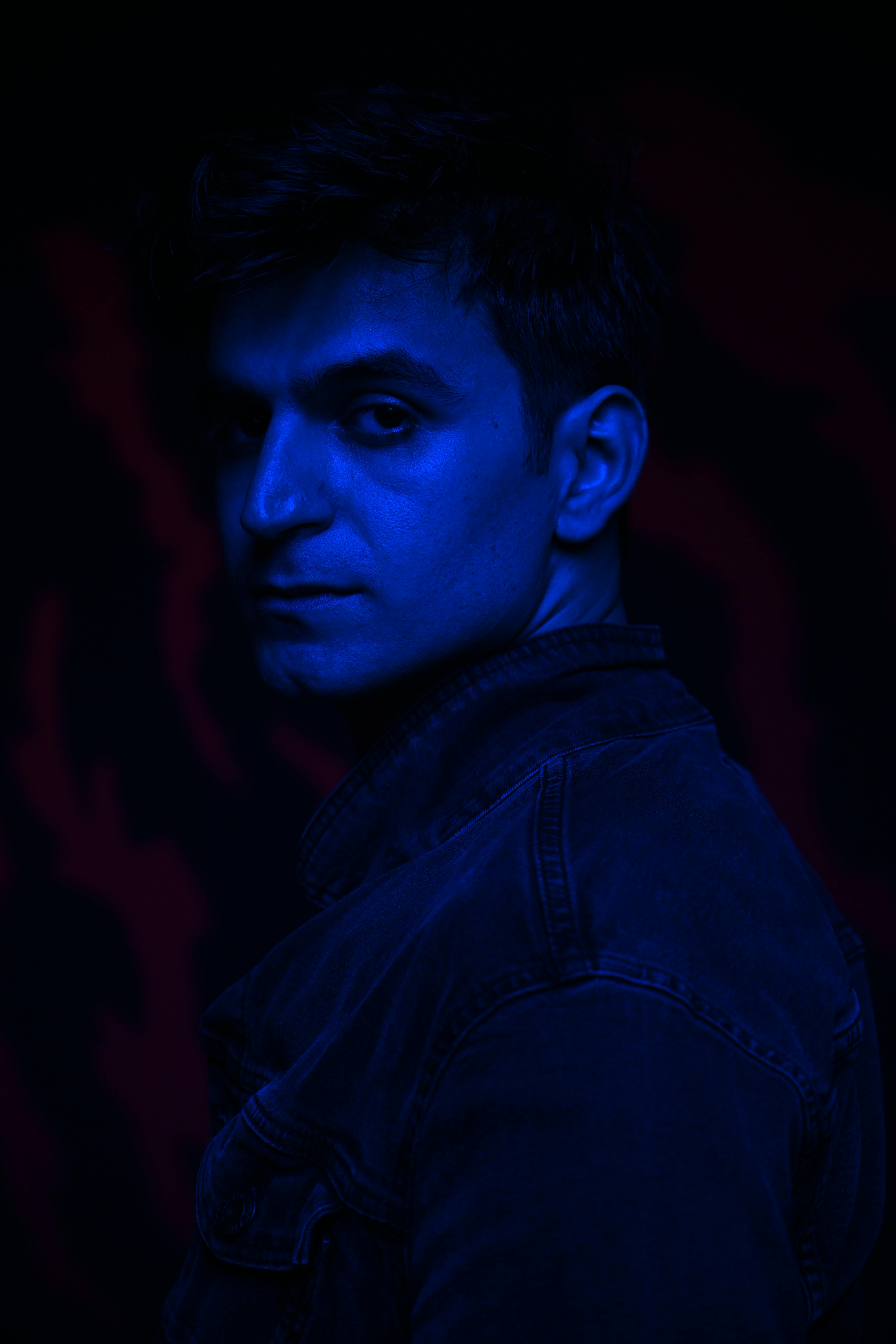 Picture of a Young Man in Blue Lighting · Free Stock Photo