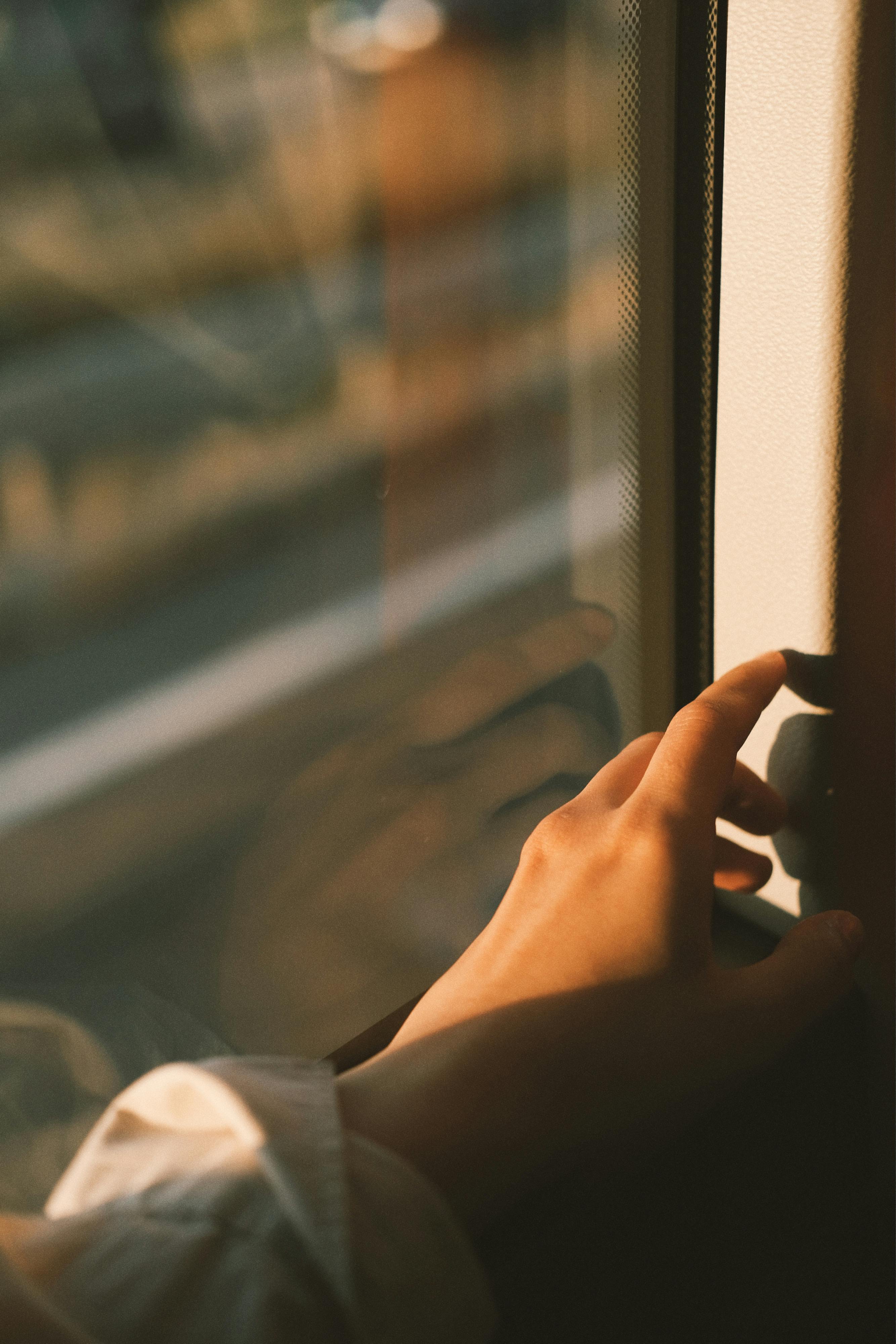 Hand over Blinds on Window · Free Stock Photo