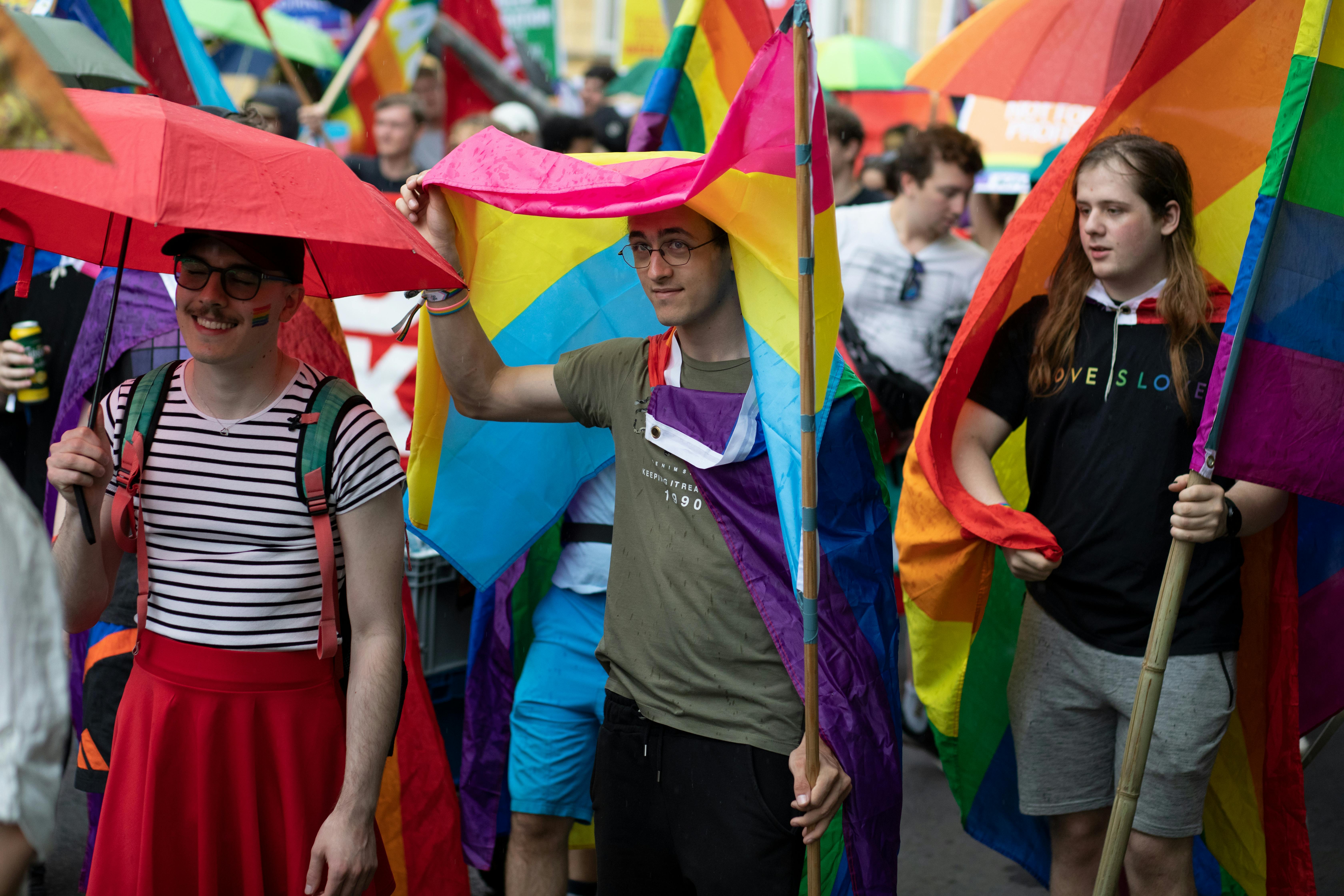 Men Walking with Flags on Parade · Free Stock Photo