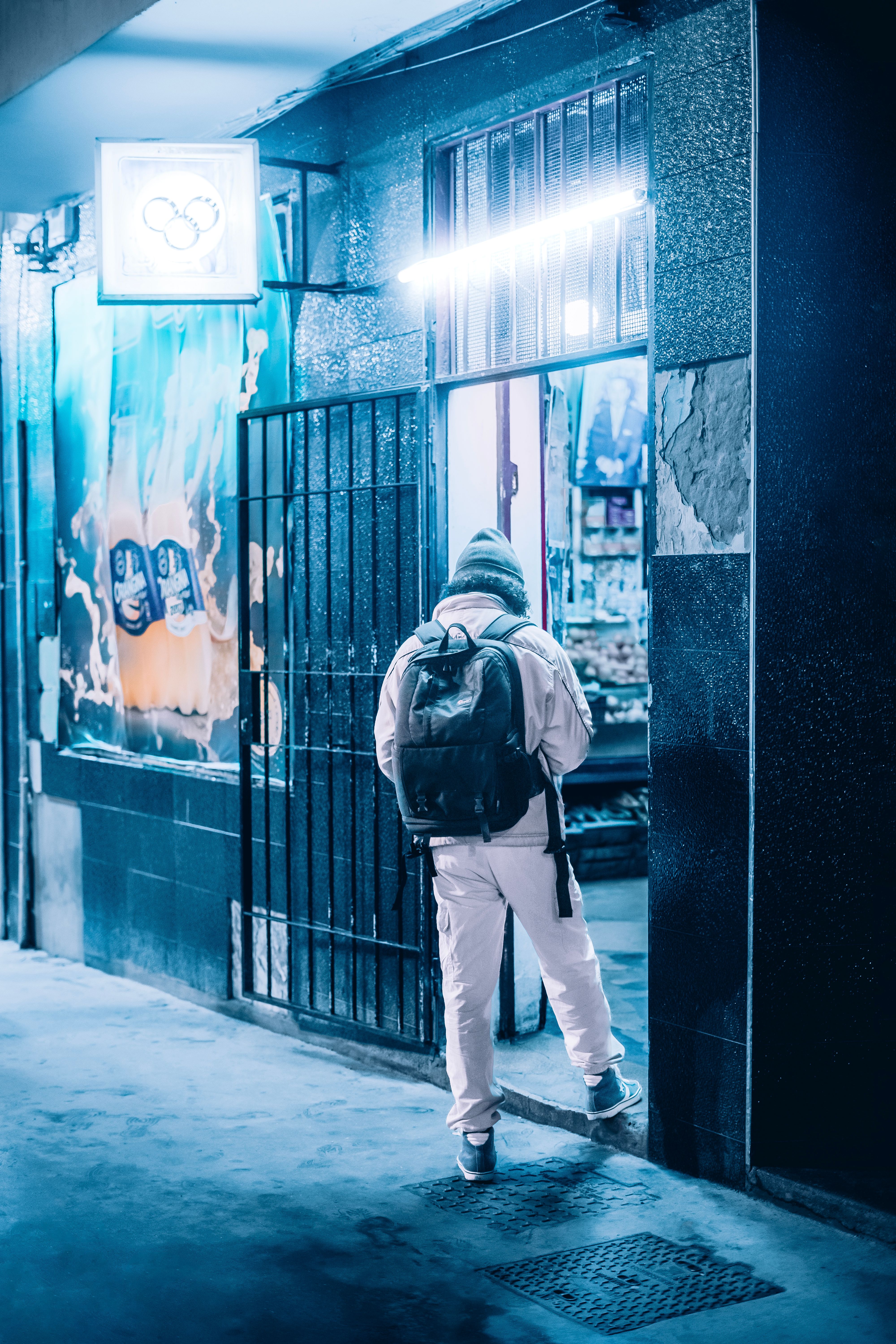 Back View of a Teenager with a Backpack Standing in a Gate of a ...