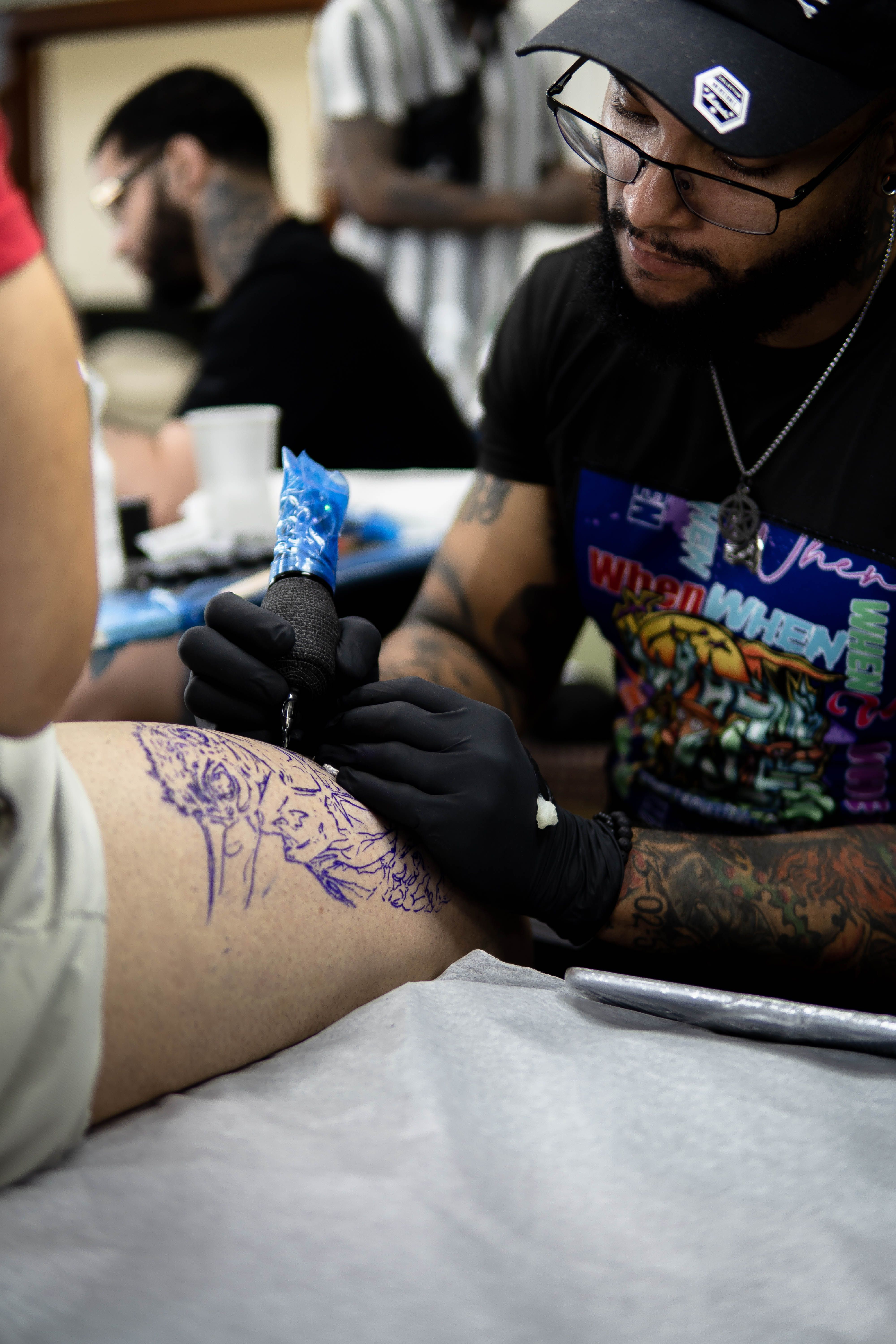 Tattooist Focused during Work · Free Stock Photo