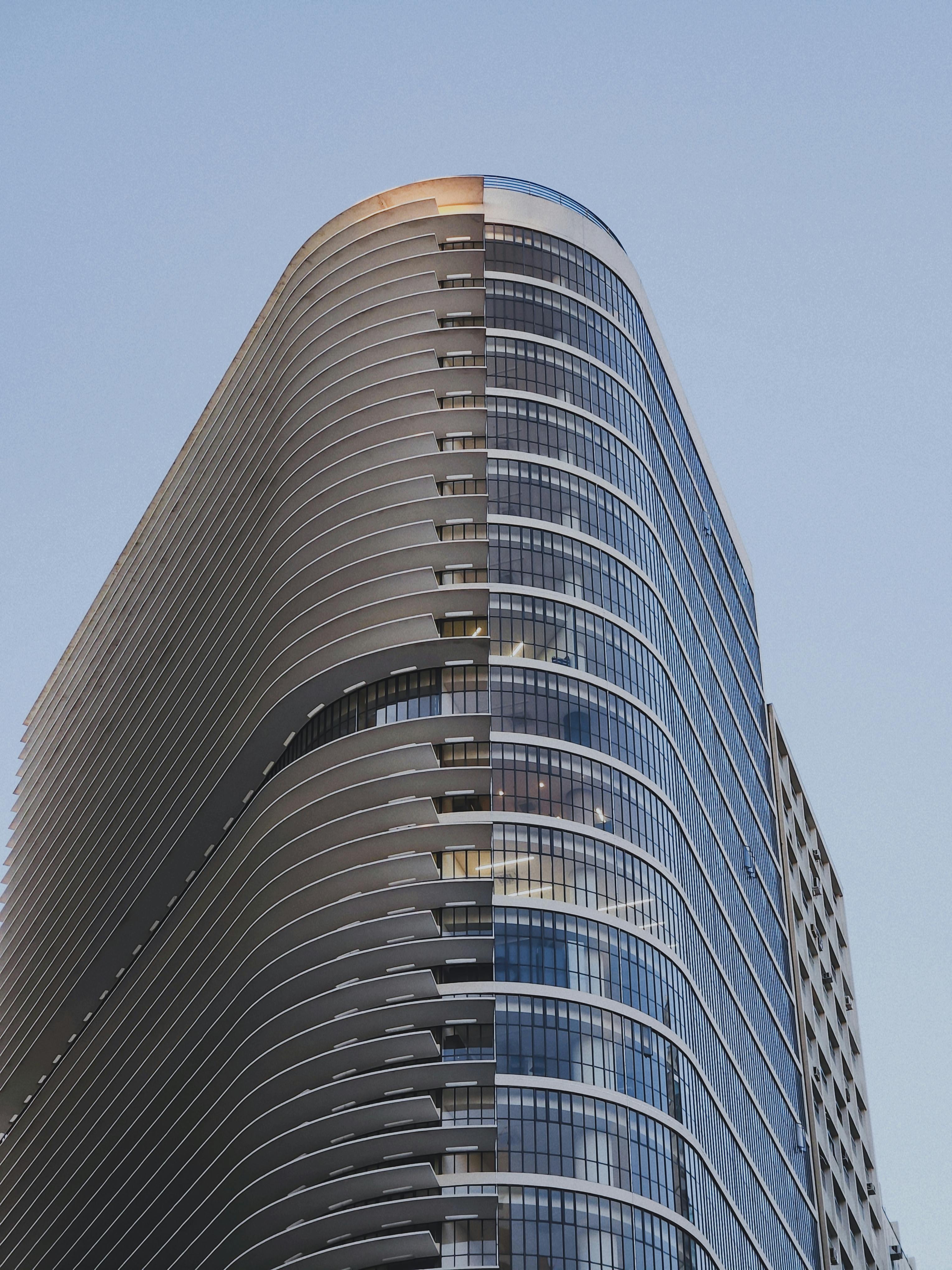 White Concrete High-rise Building at Daytime · Free Stock Photo