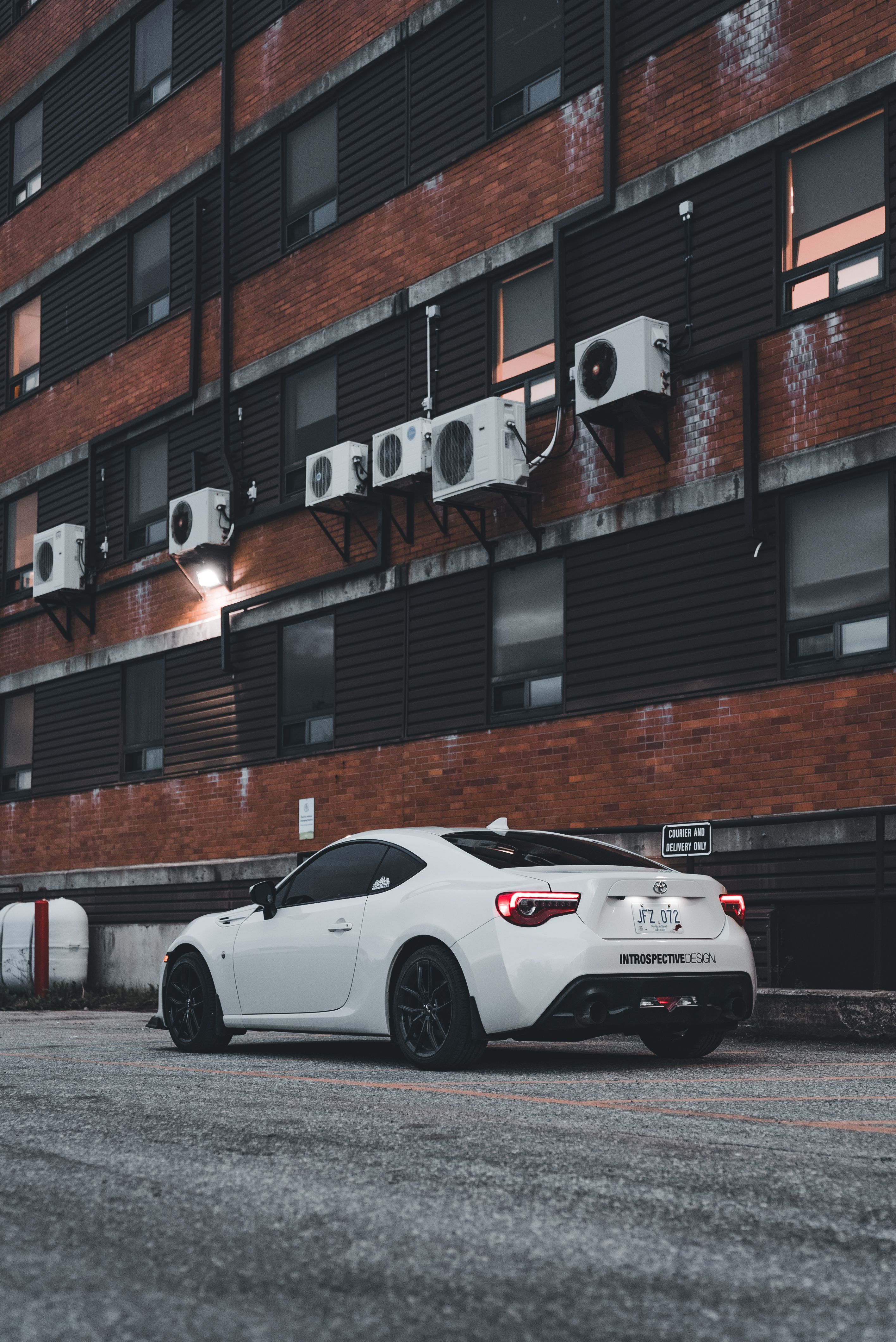 Toyota GT86 on Street by Brick Building · Free Stock Photo