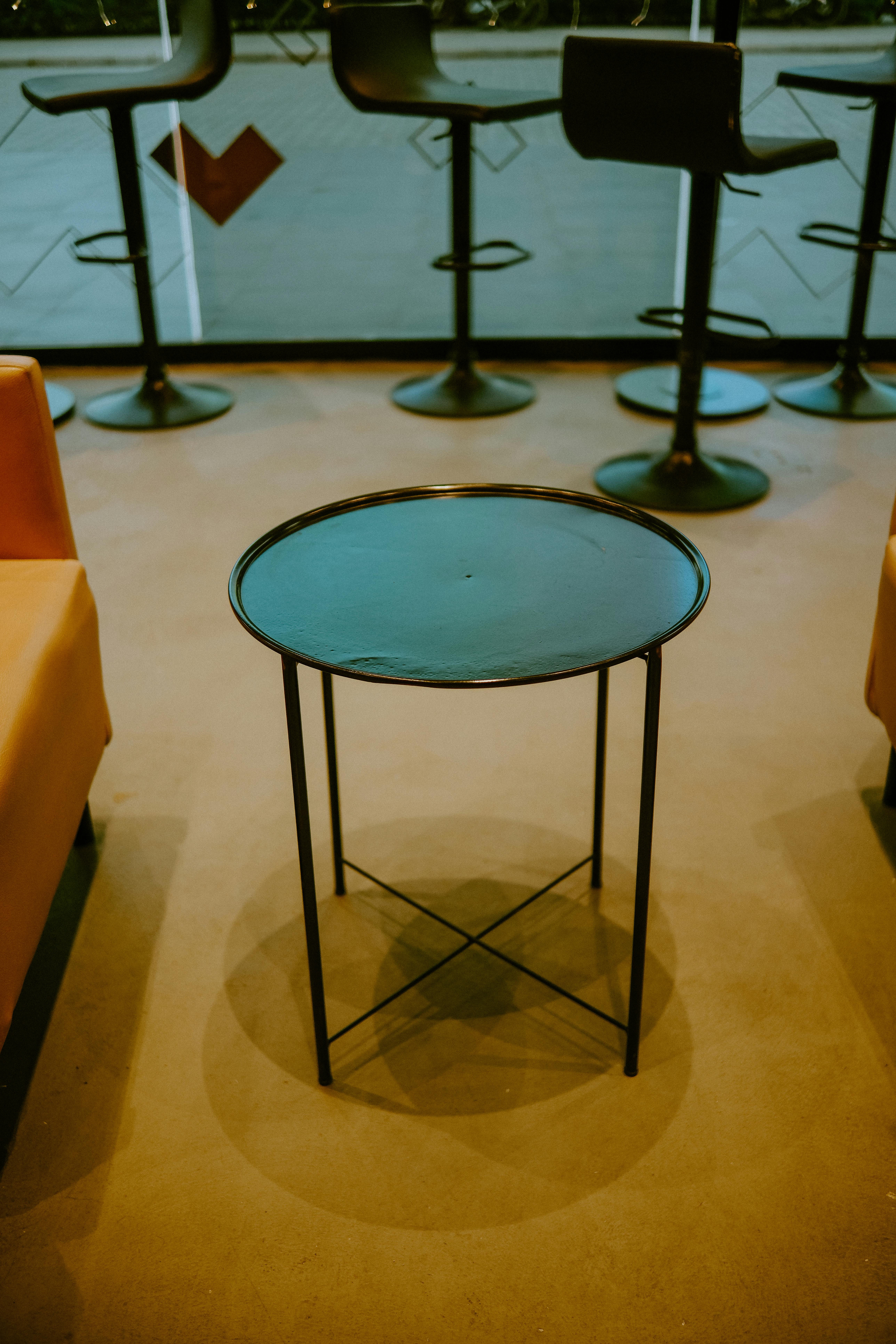 A Small Round Table between Sofas · Free Stock Photo