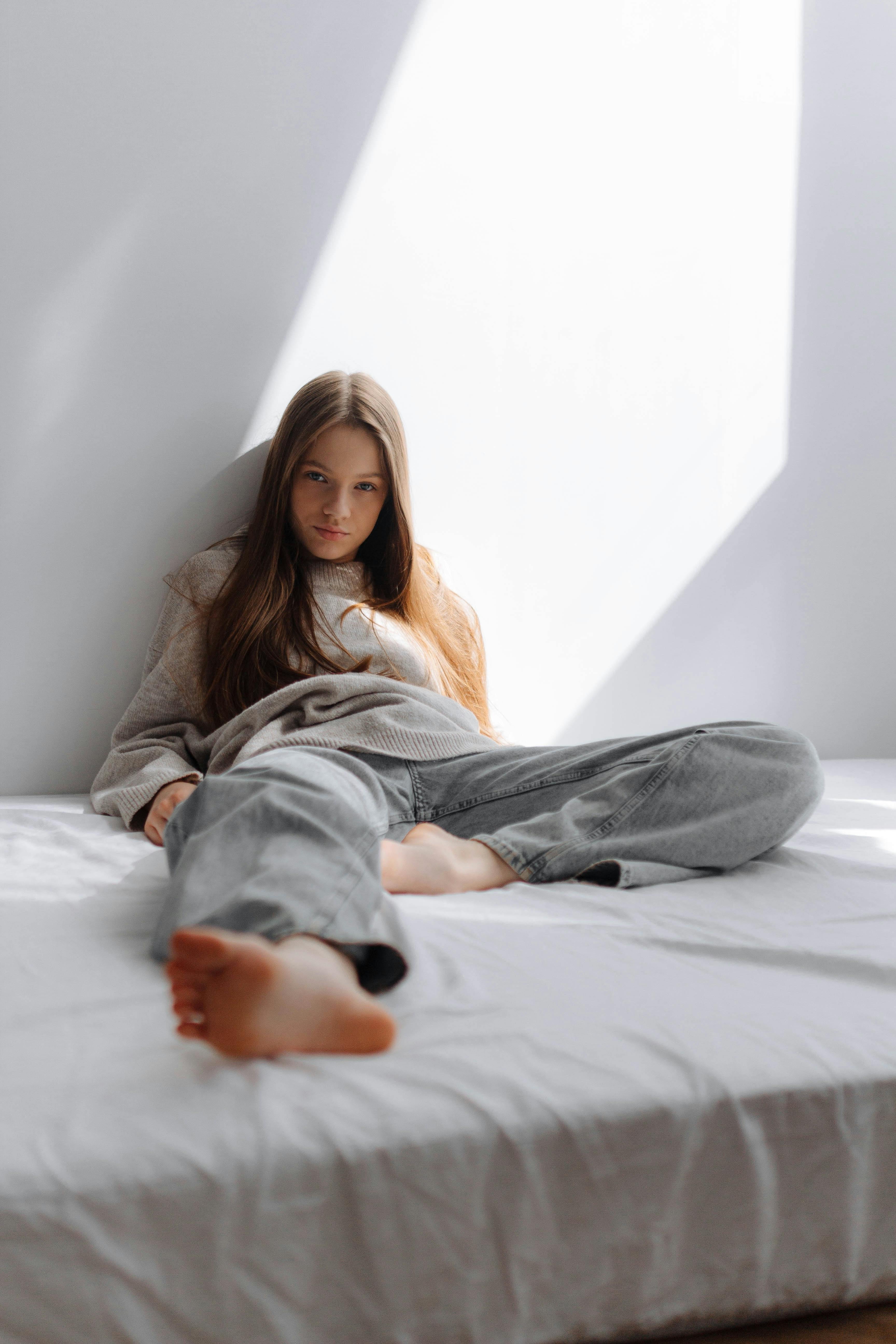 A Girl Lying on a Mattress · Free Stock Photo
