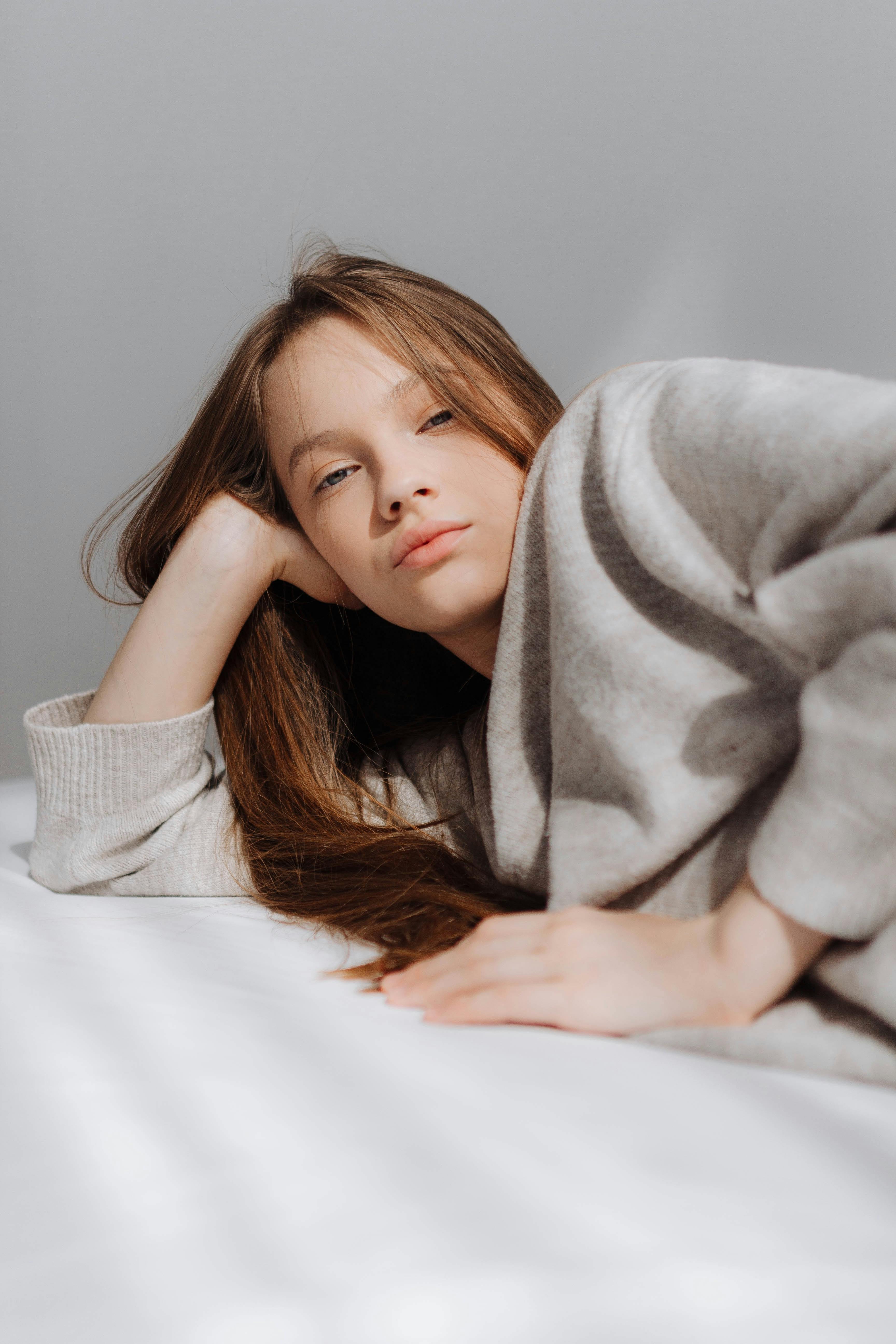 Woman Leaning Head on Hand · Free Stock Photo