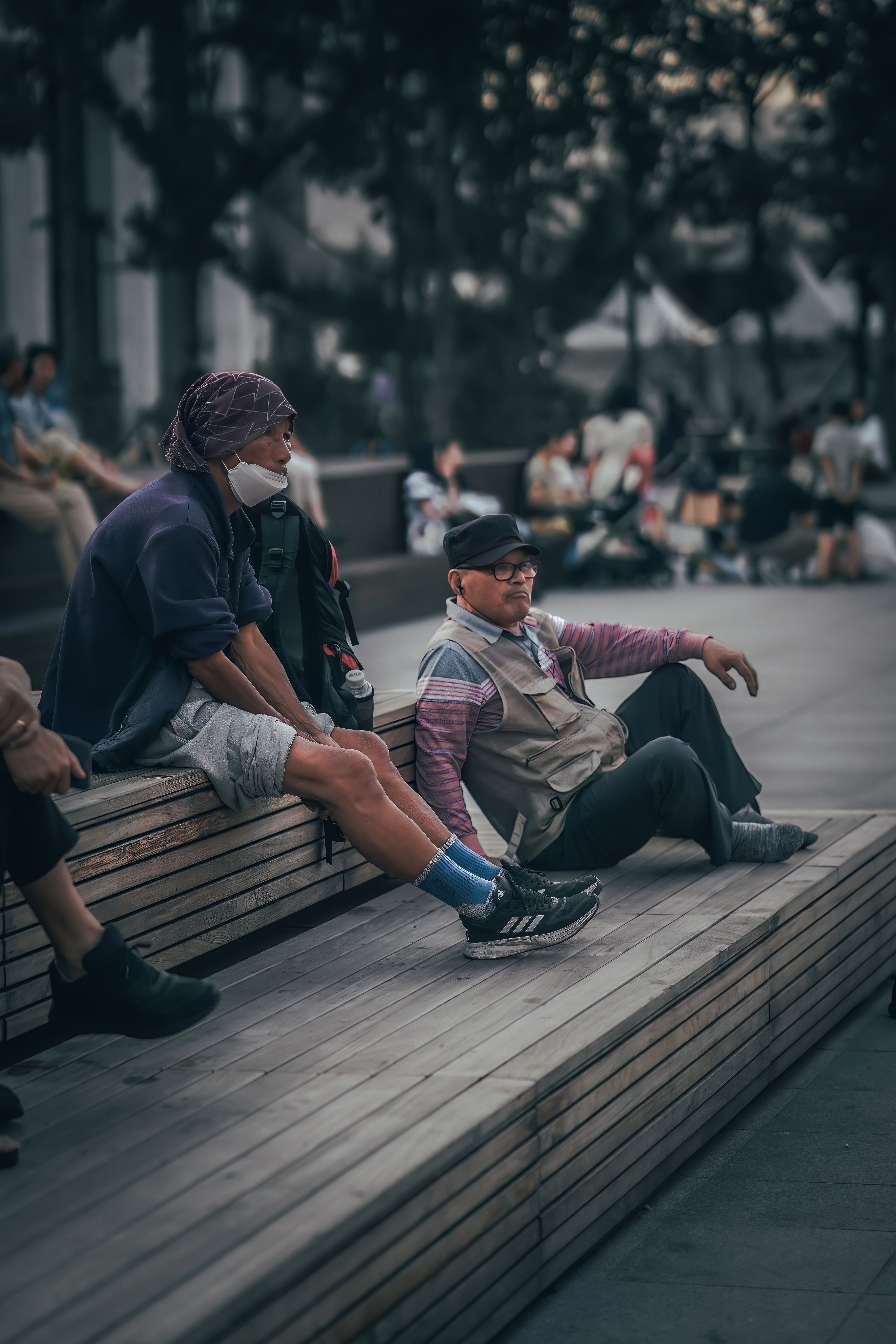 People Sitting on Wooden Benches · Free Stock Photo