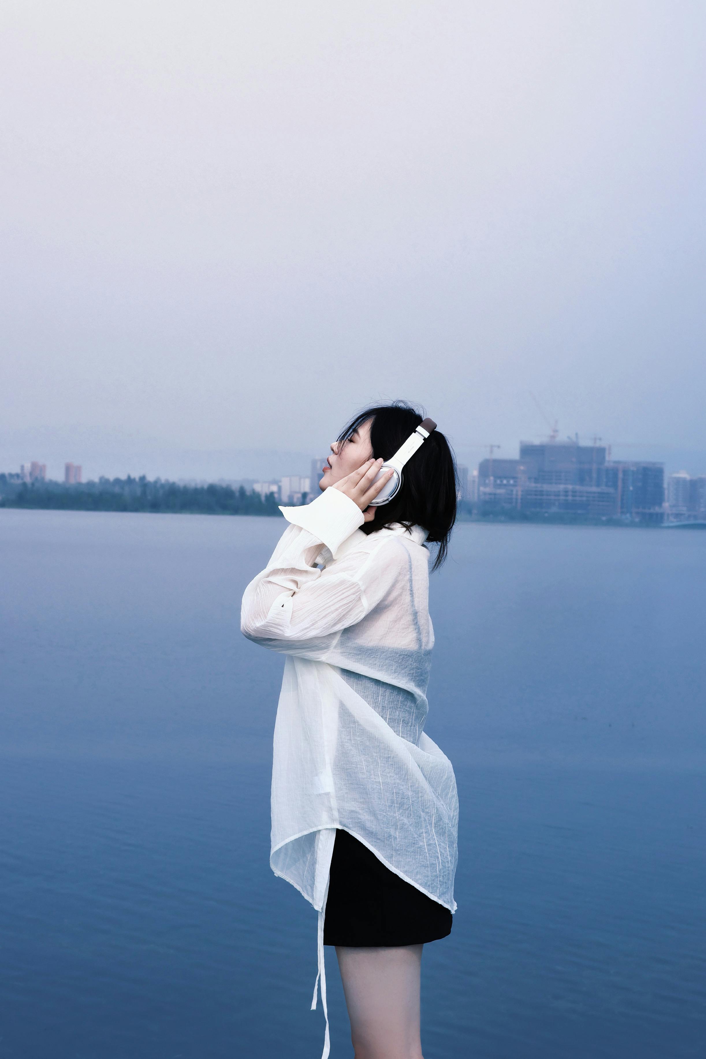 Female Model Posing on a Sandy Beach in a One Piece Swimsuit · Free ...