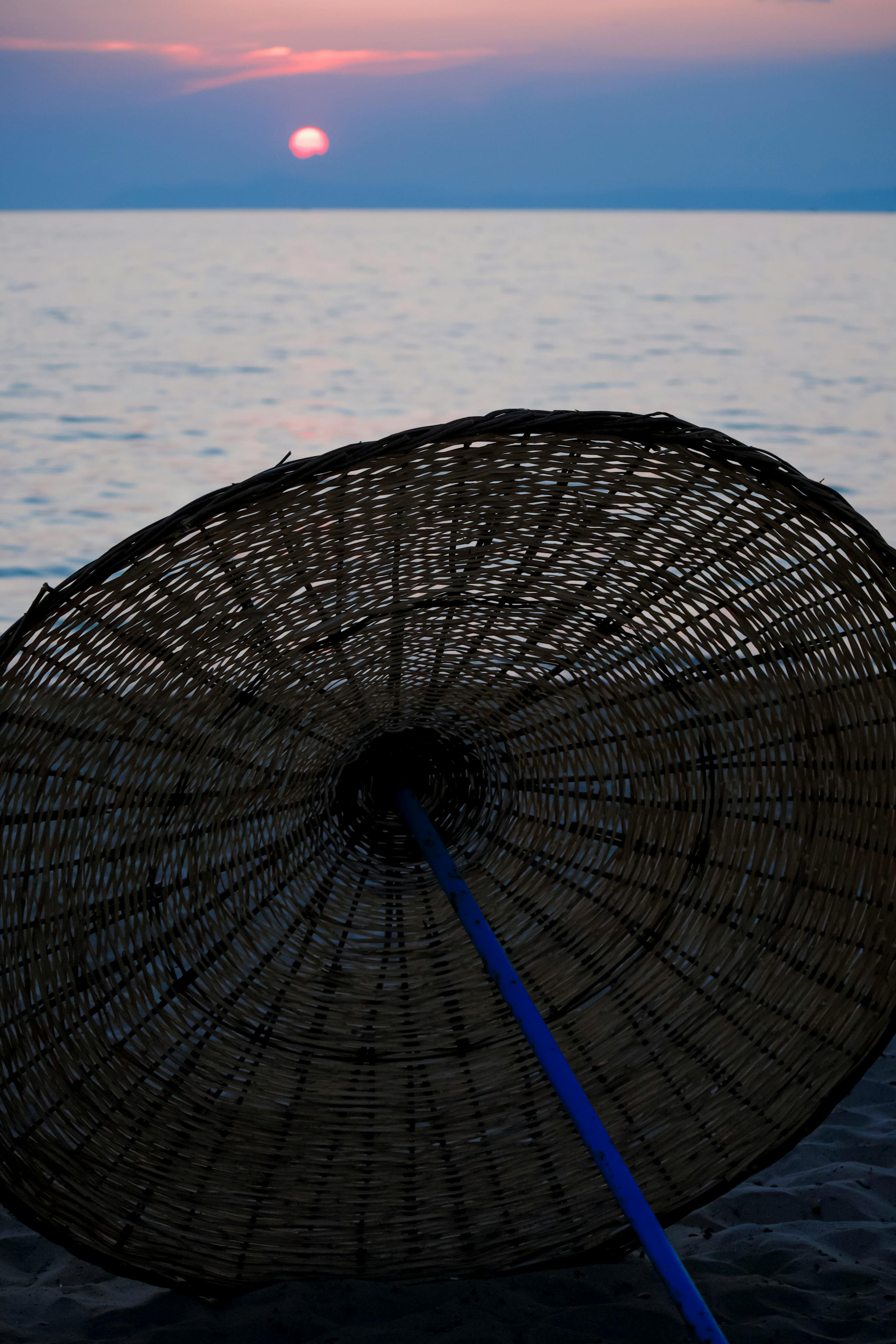Wicker Umbrella on Beach at Sunset · Free Stock Photo