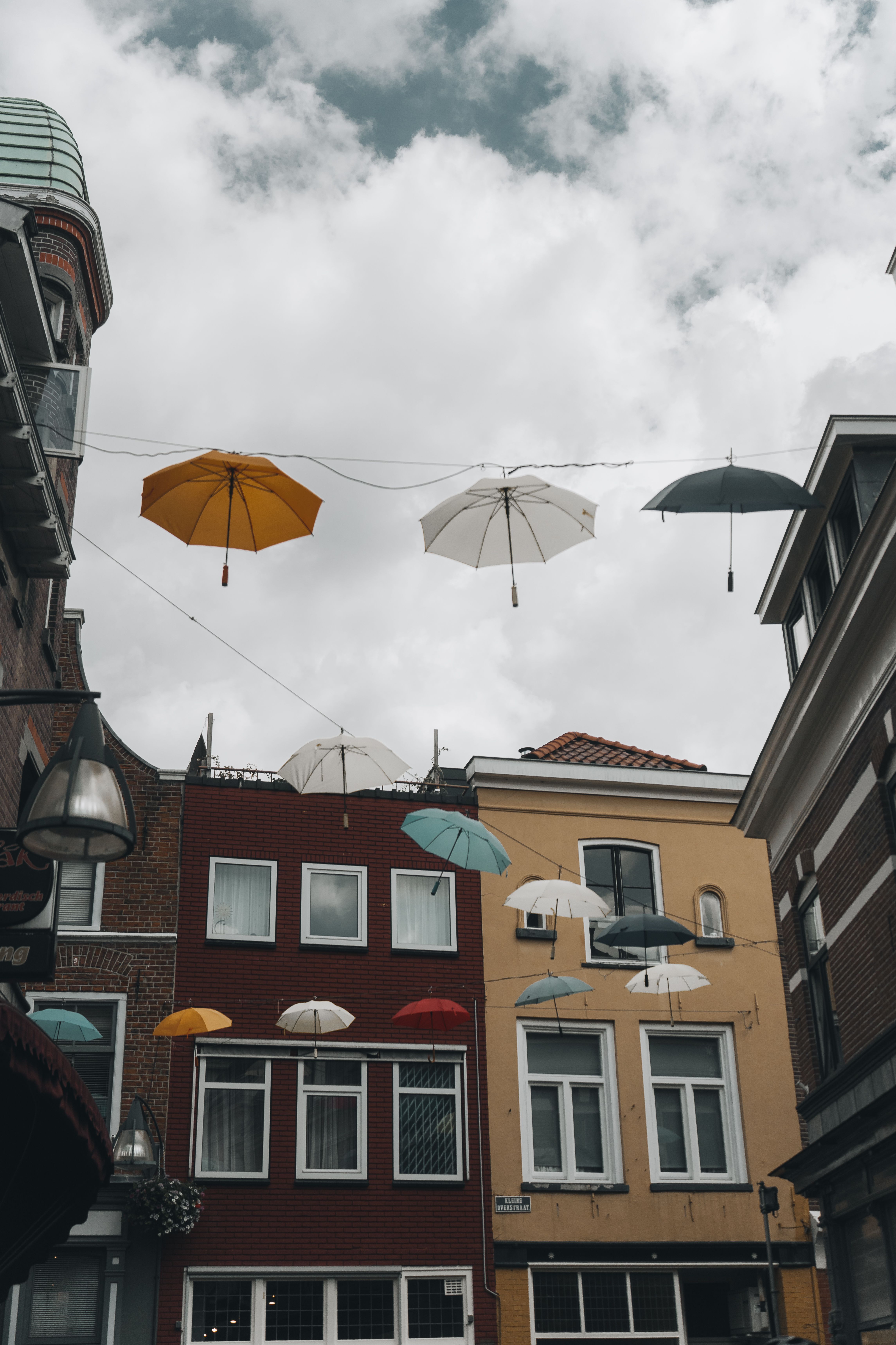 Colorful Umbrellas Hanging over the Street Between Houses · Free Stock ...