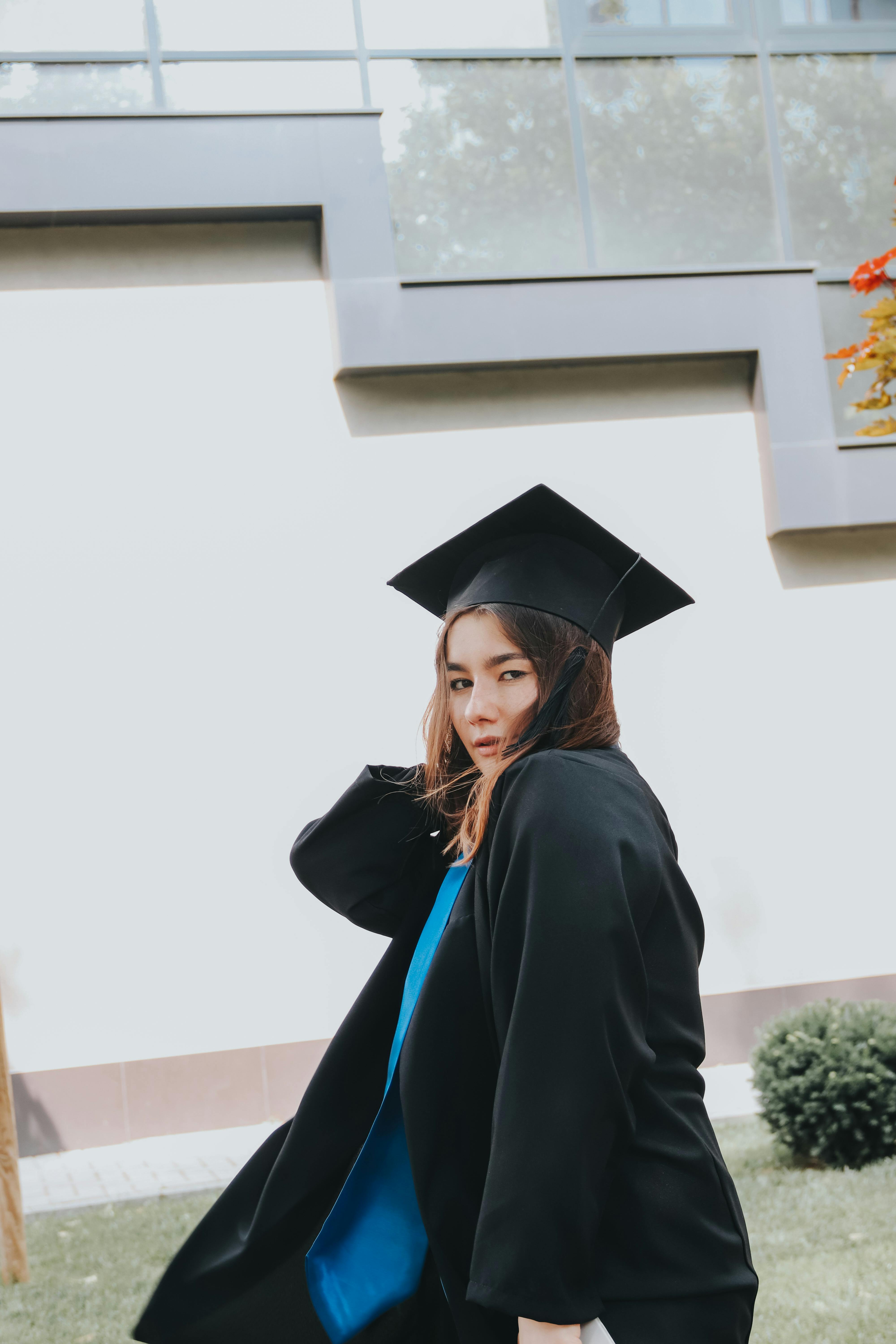Portrait of a Girl in a Graduation Gown · Free Stock Photo