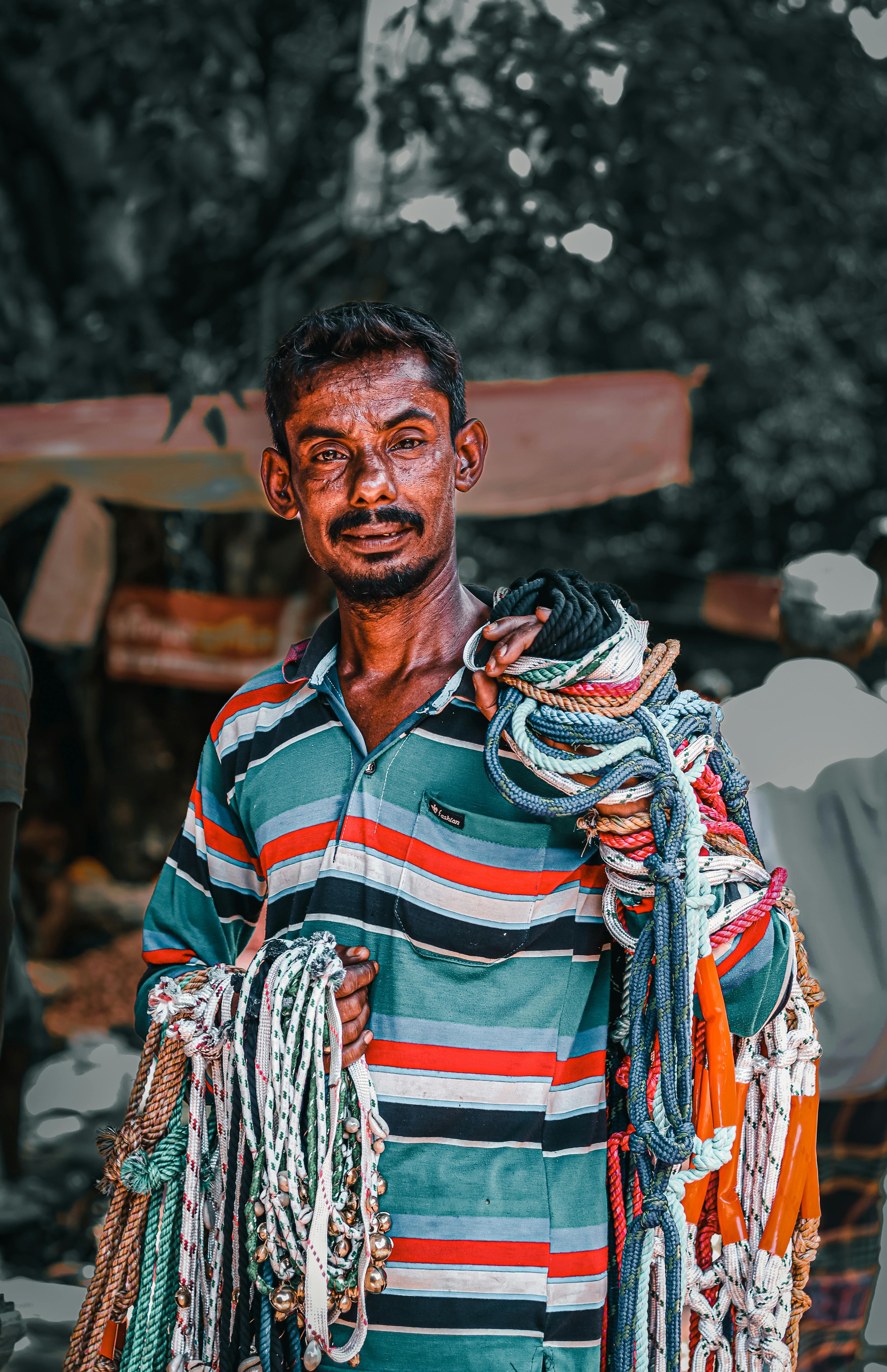 Man Standing and Holding Ropes · Free Stock Photo