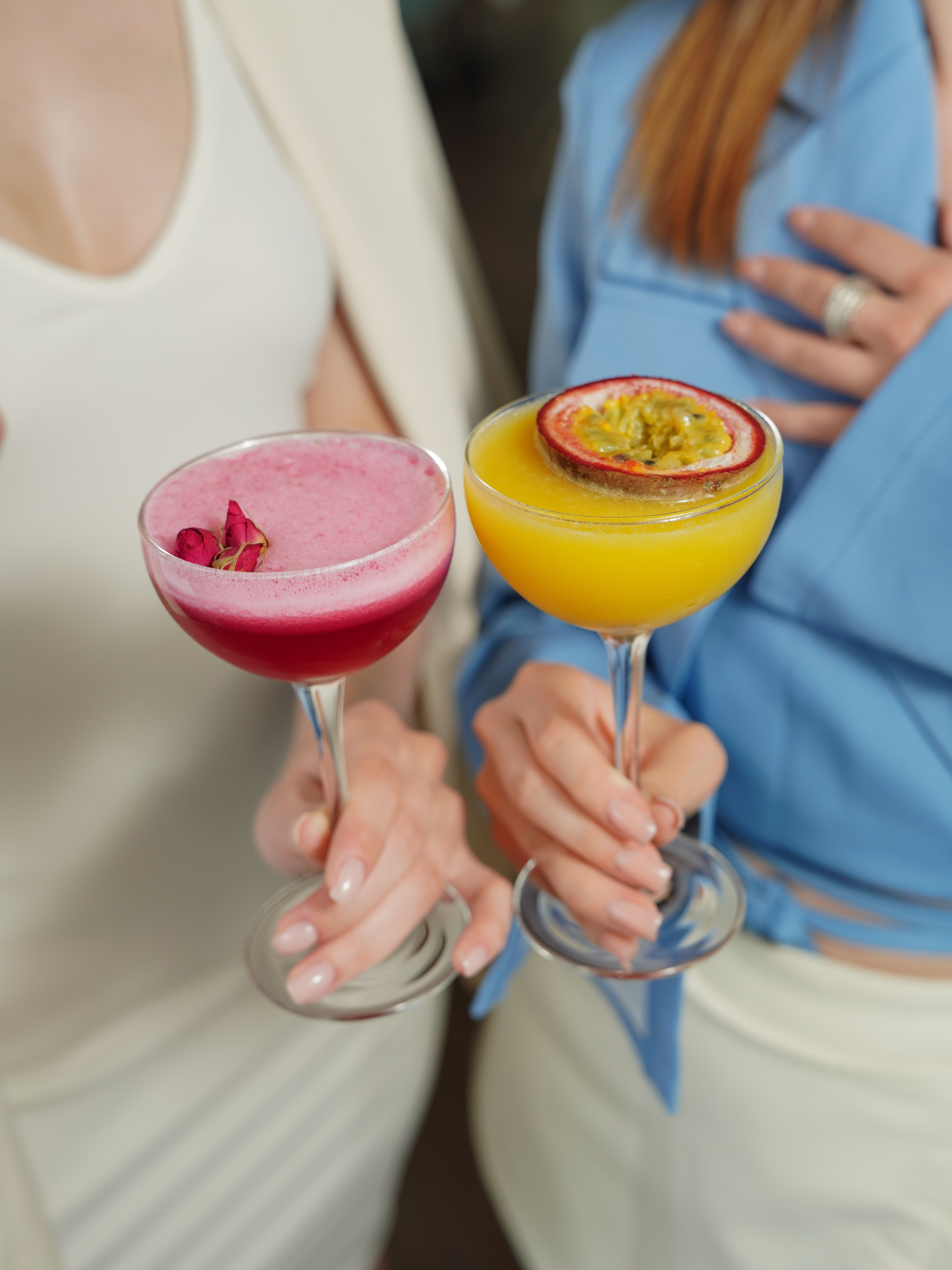 Women Holding Cocktails with Tropical Fruit · Free Stock Photo