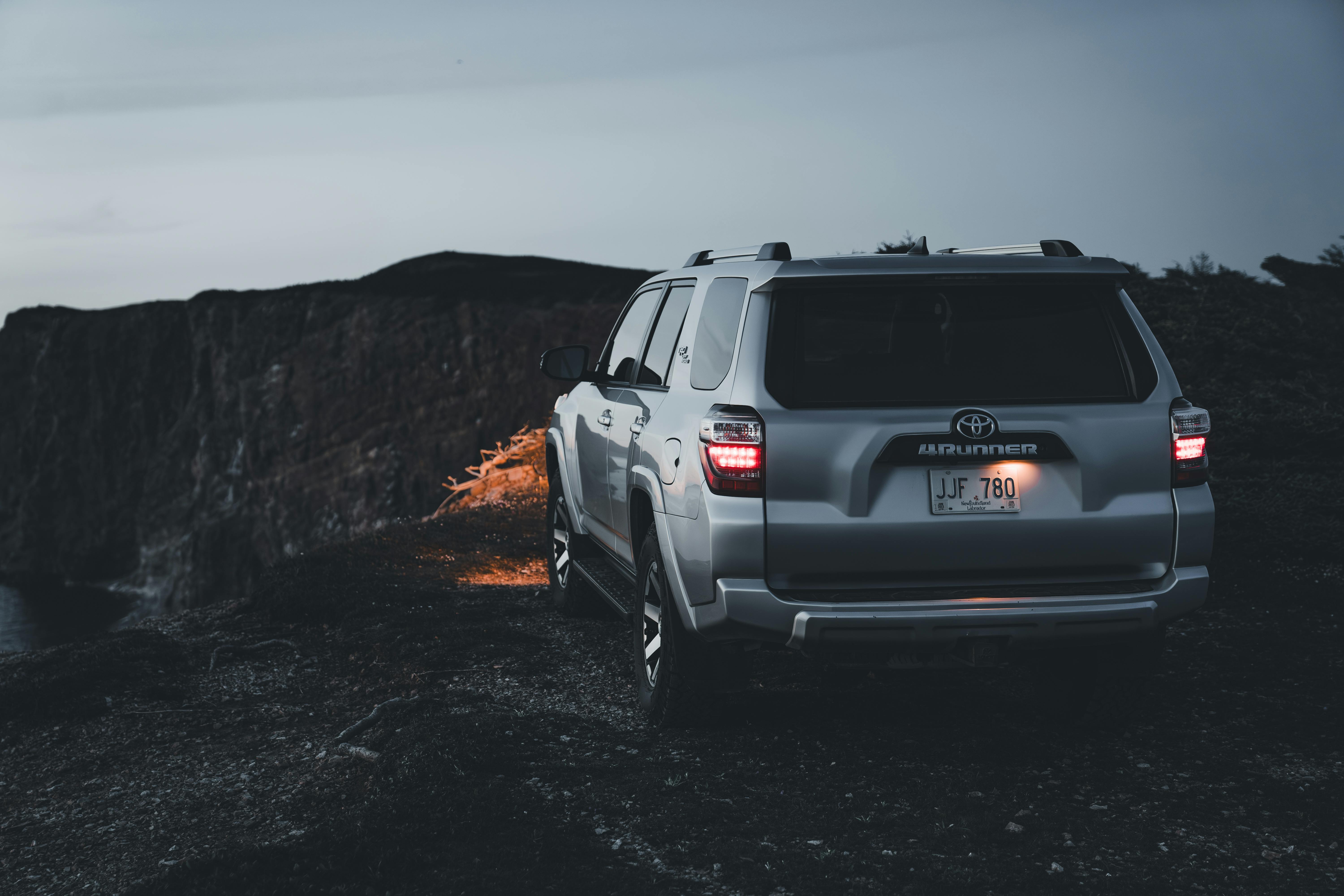 A Toyota 4Runner Parked on the Shore · Free Stock Photo