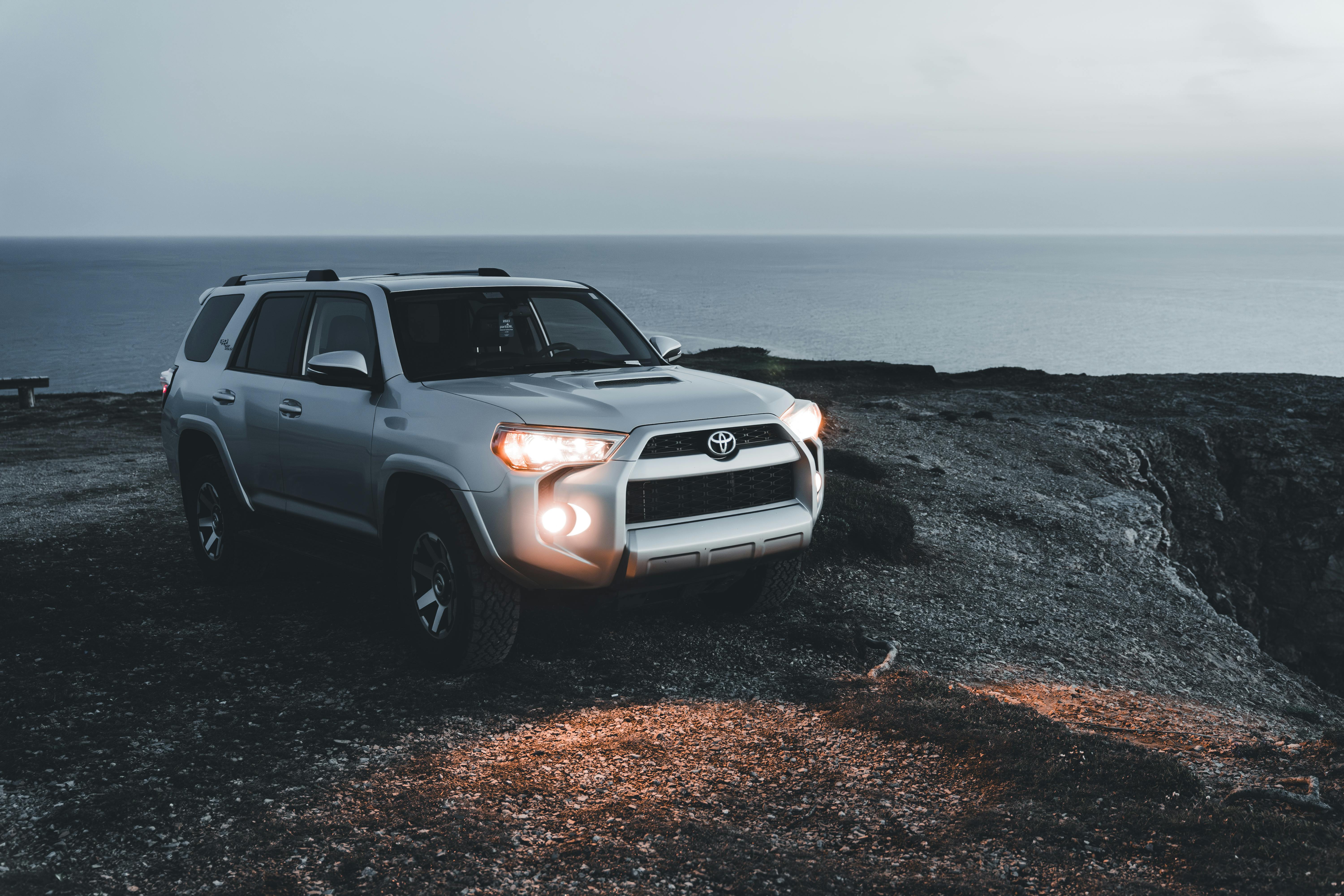 A Toyota 4Runner Parked on the Shore · Free Stock Photo