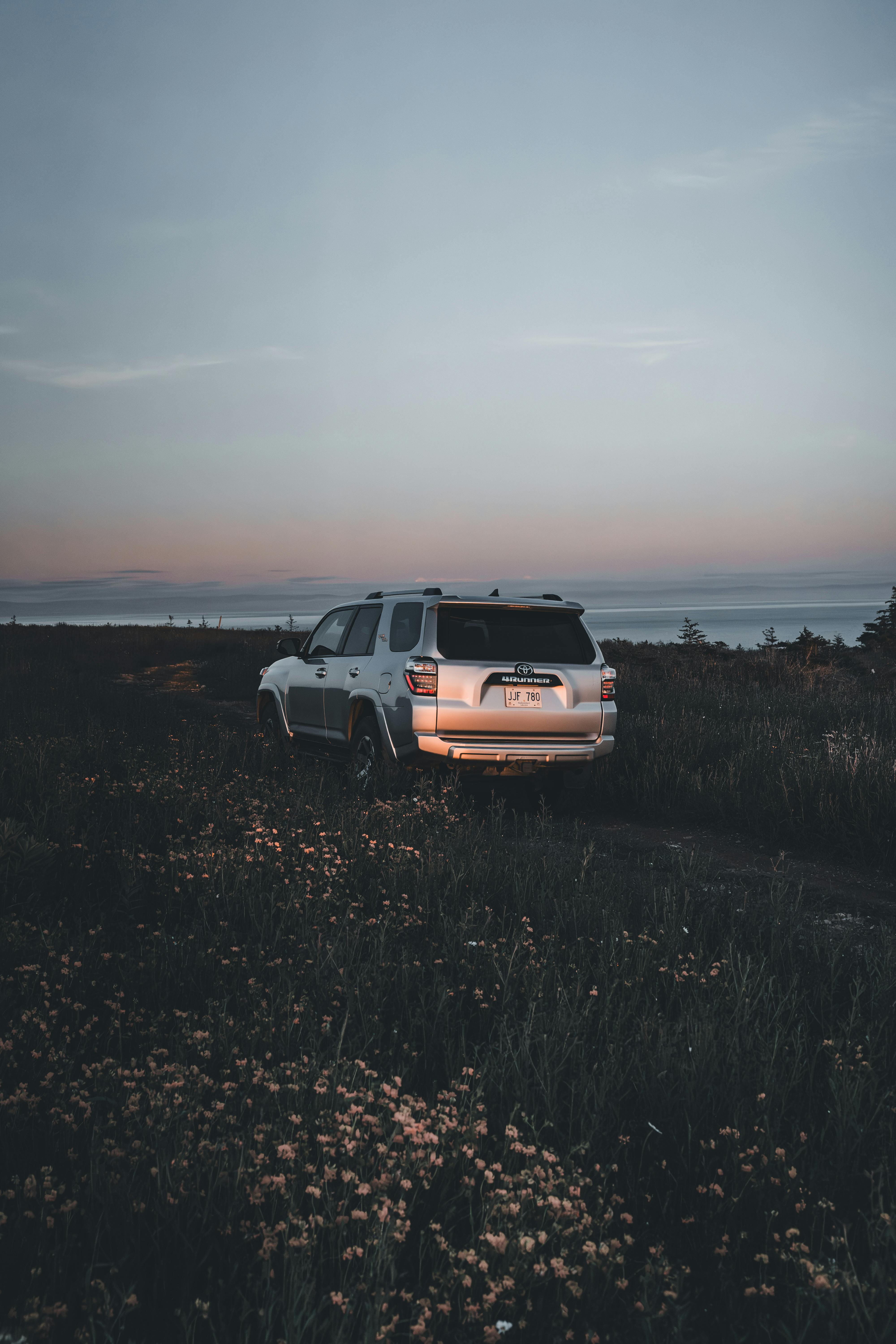 A Toyota 4Runner Parked on the Shore · Free Stock Photo