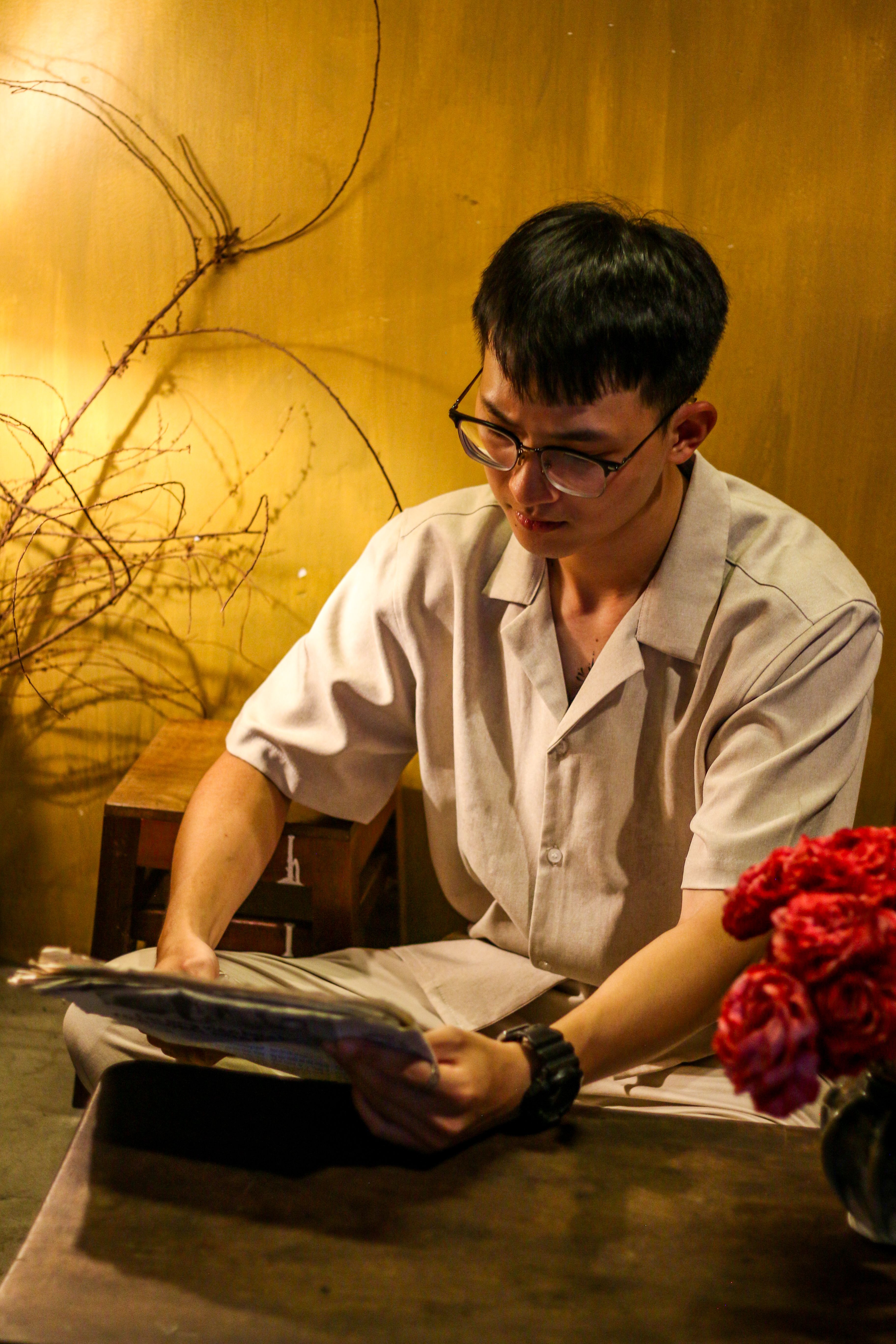 Man Sitting and Reading Book · Free Stock Photo
