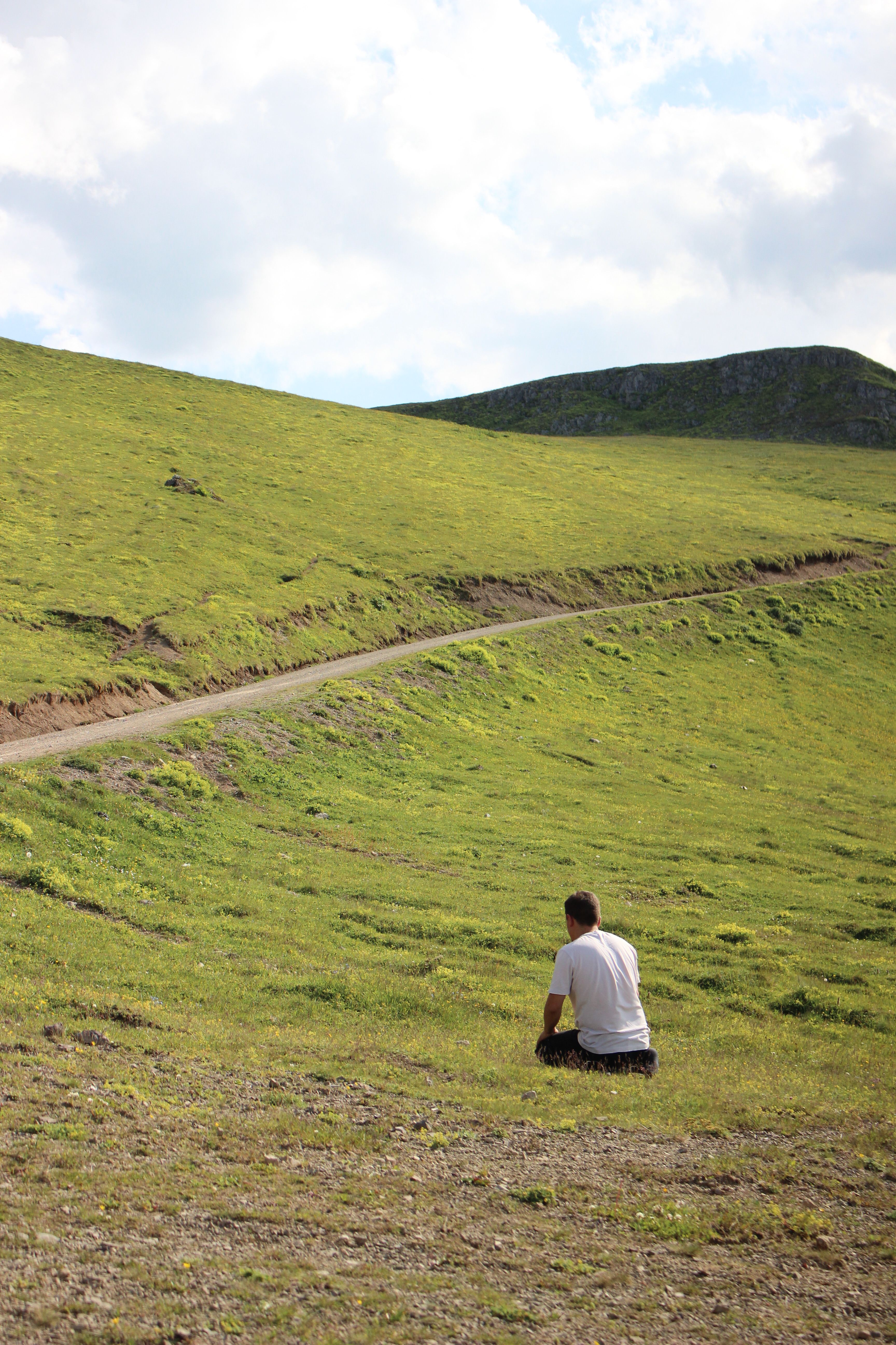 A Man Sitting in a Field · Free Stock Photo