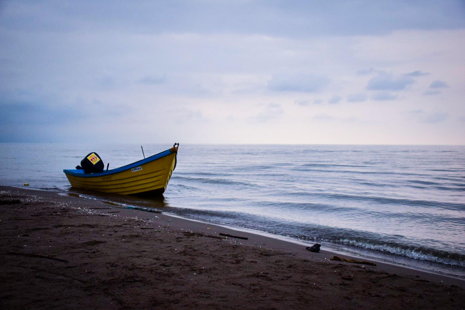 Boat Beside Beach Shore · Free Stock Photo