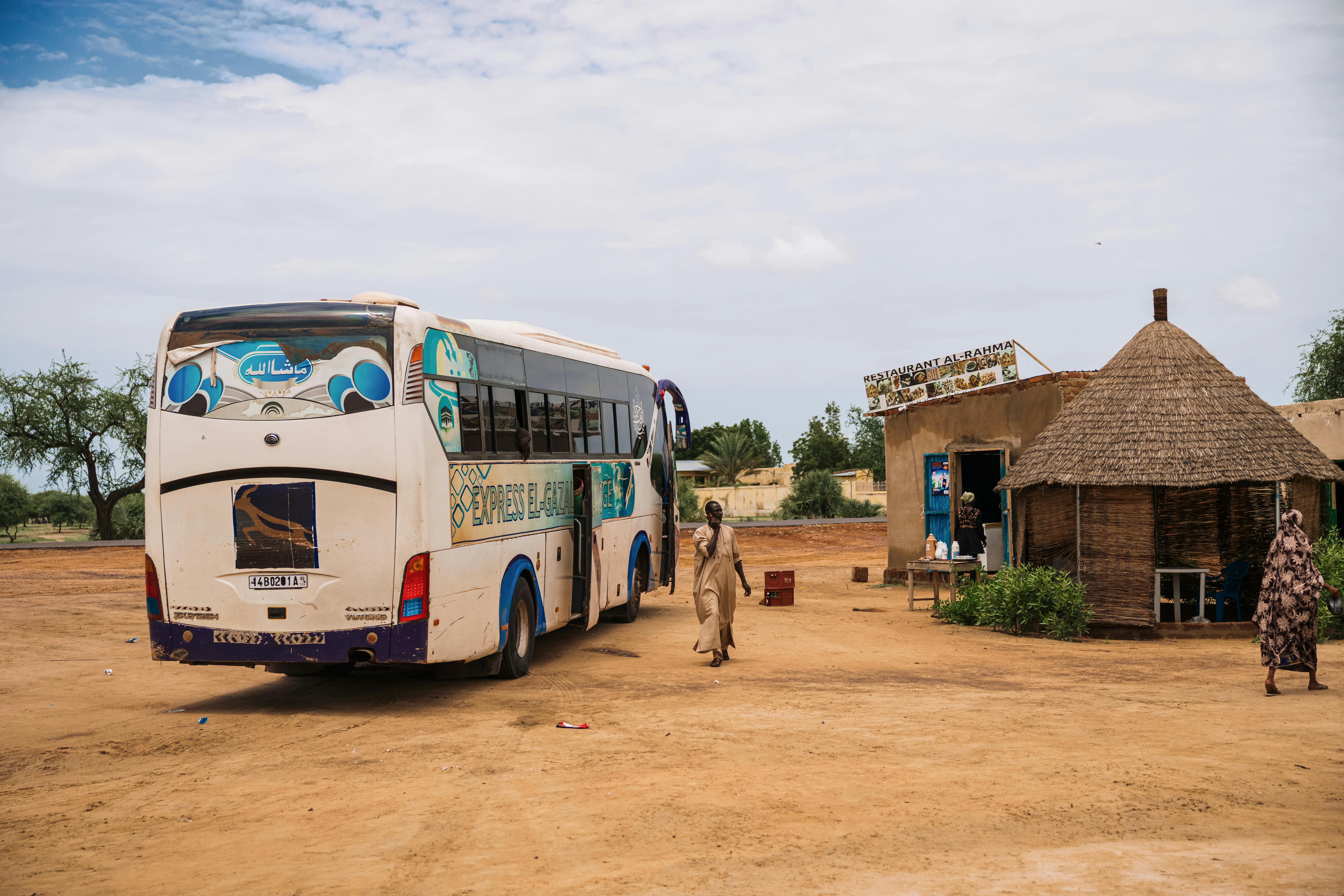 White Bus in Tribal Village · Free Stock Photo