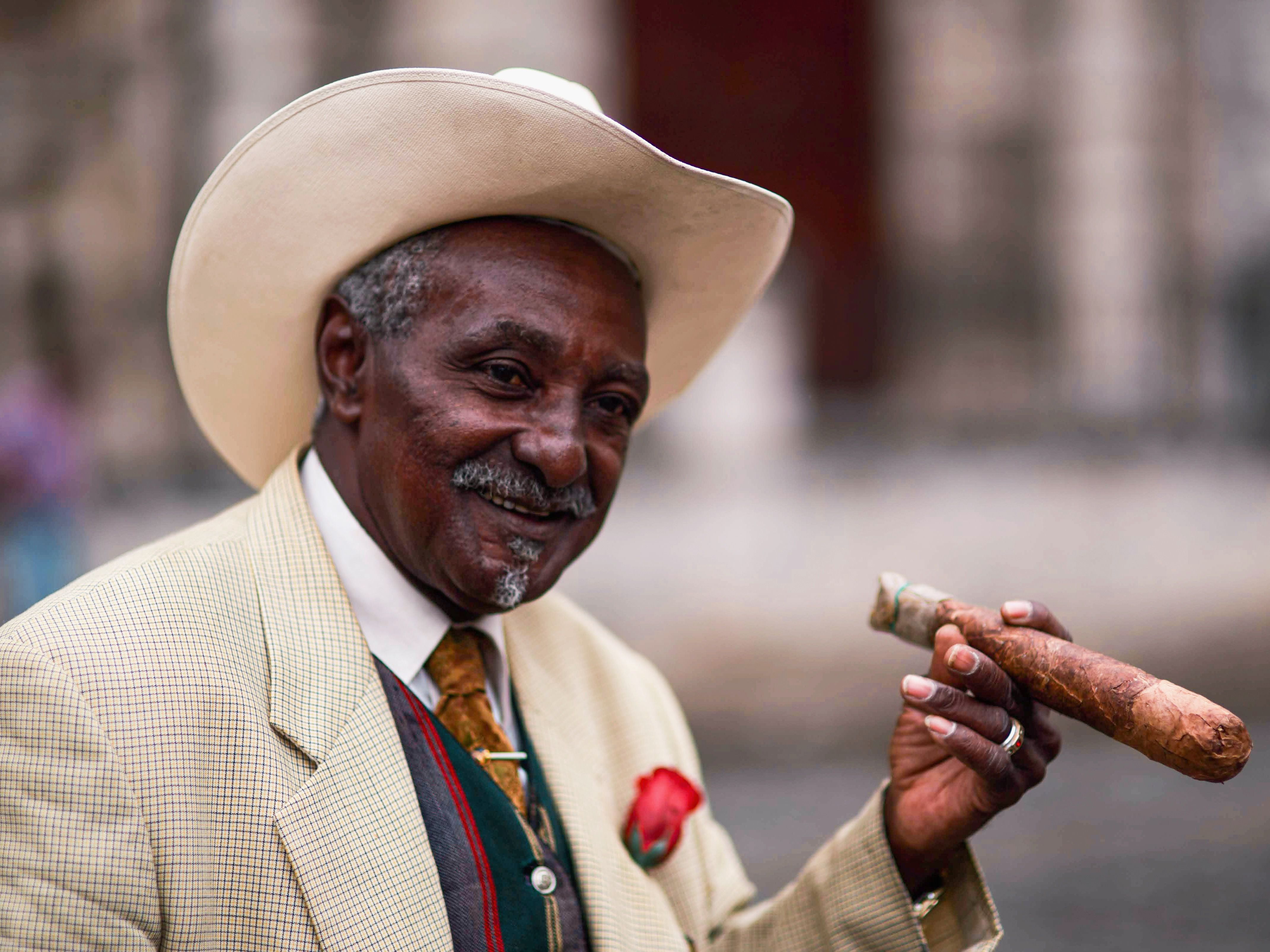 Man Holding Giant Cigar · Free Stock Photo