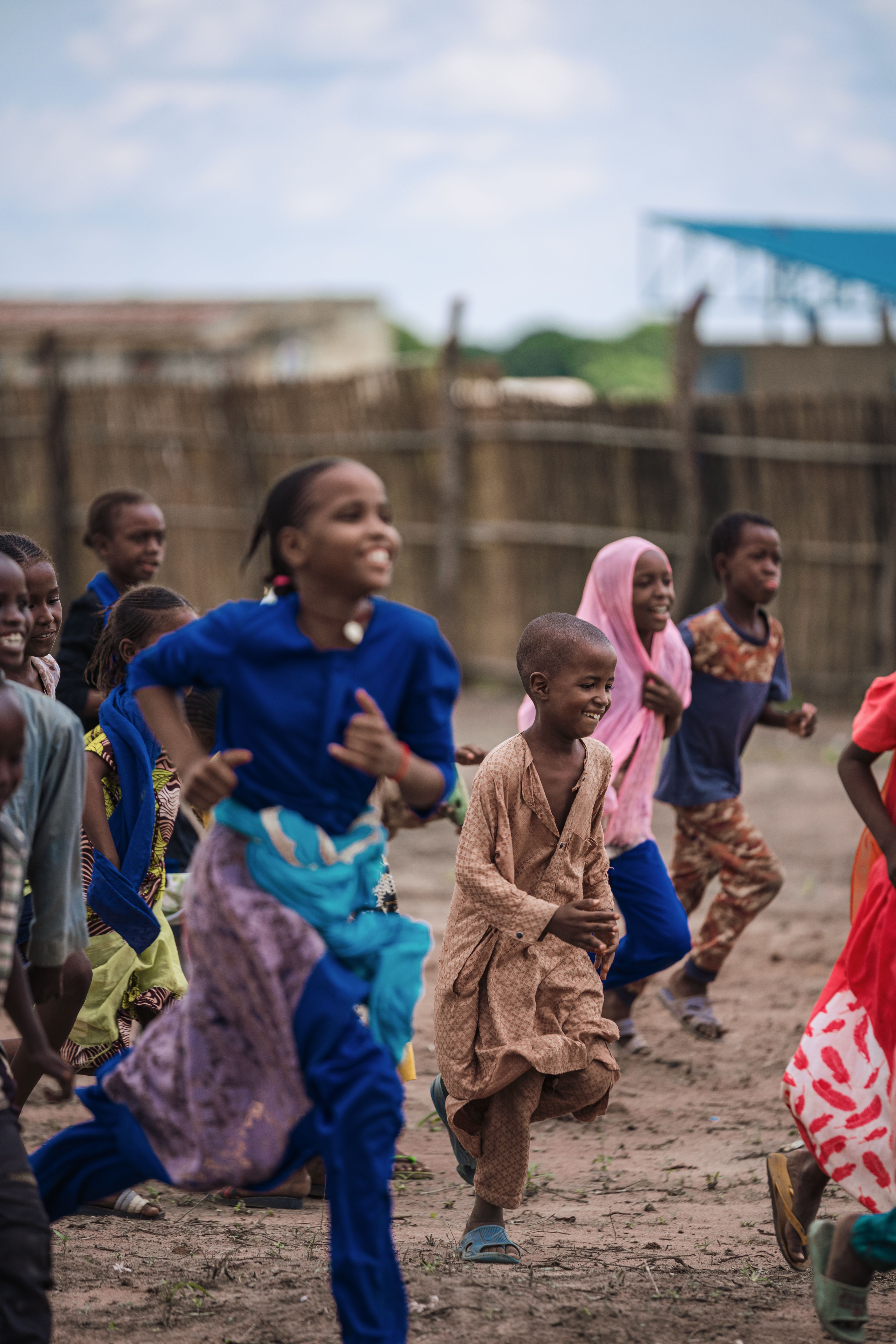 Smiling Children Running · Free Stock Photo
