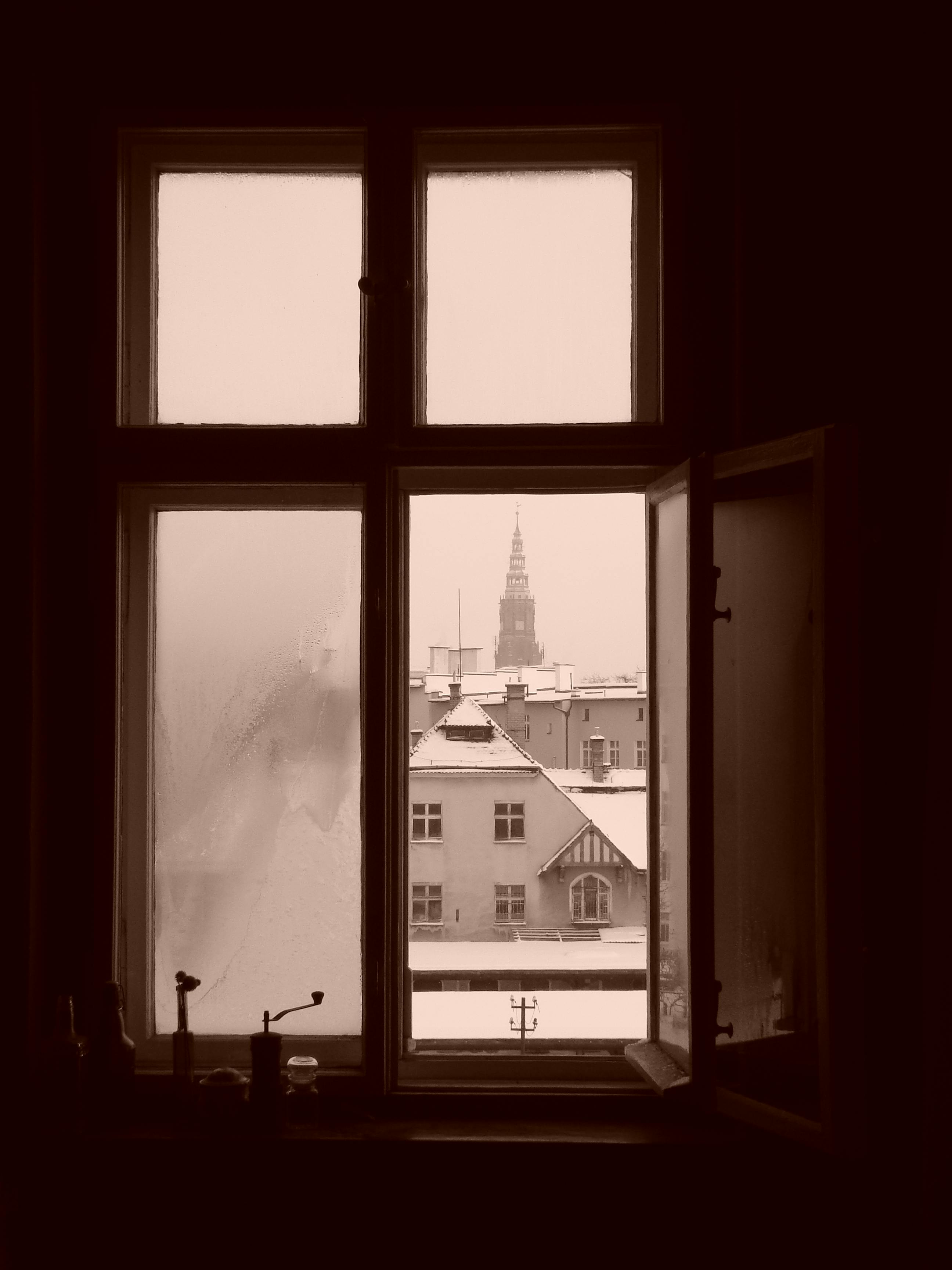 Buildings and Church Tower behind Windows · Free Stock Photo