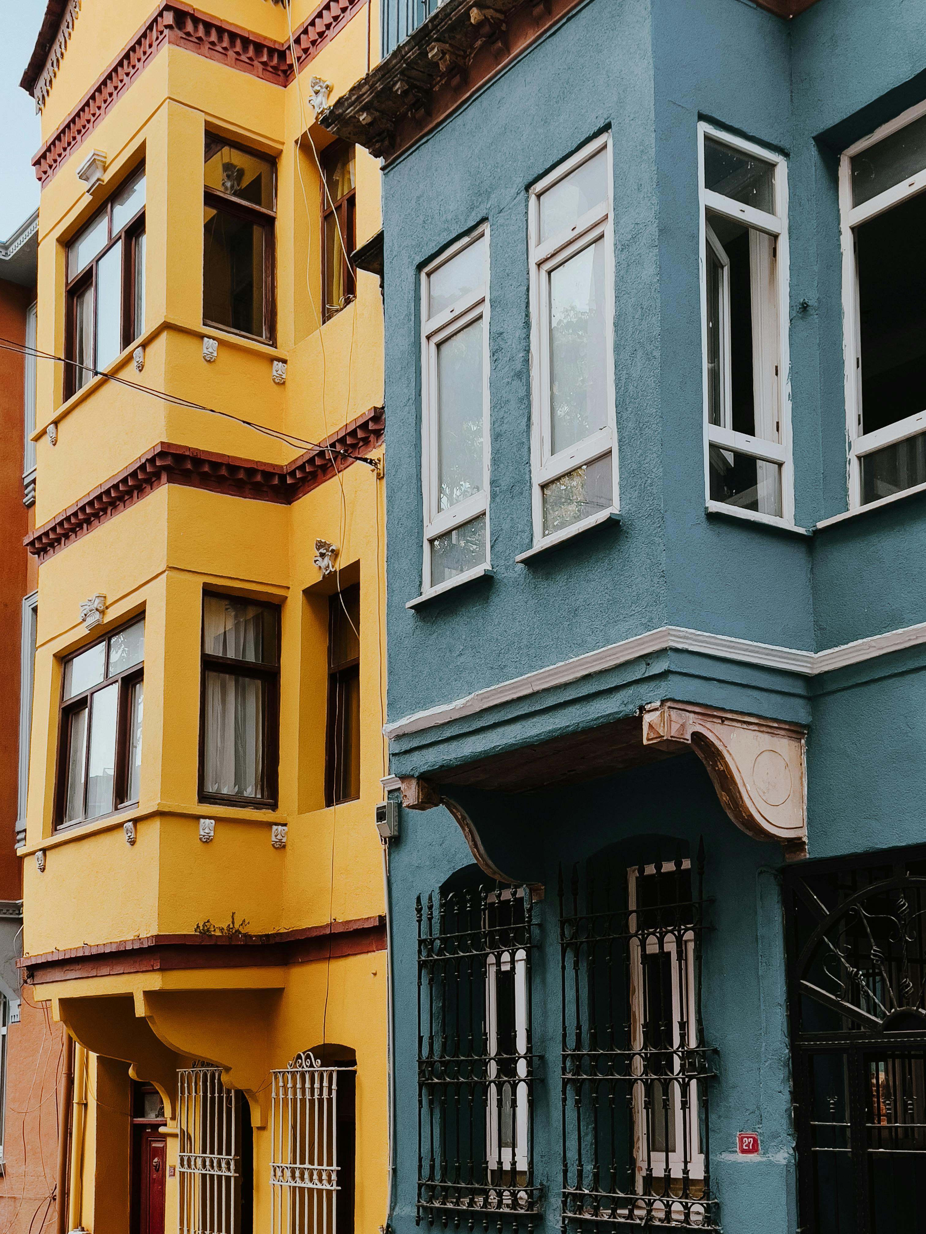 Blue and Yellow Walls of Buildings in Town in Turkey · Free Stock Photo