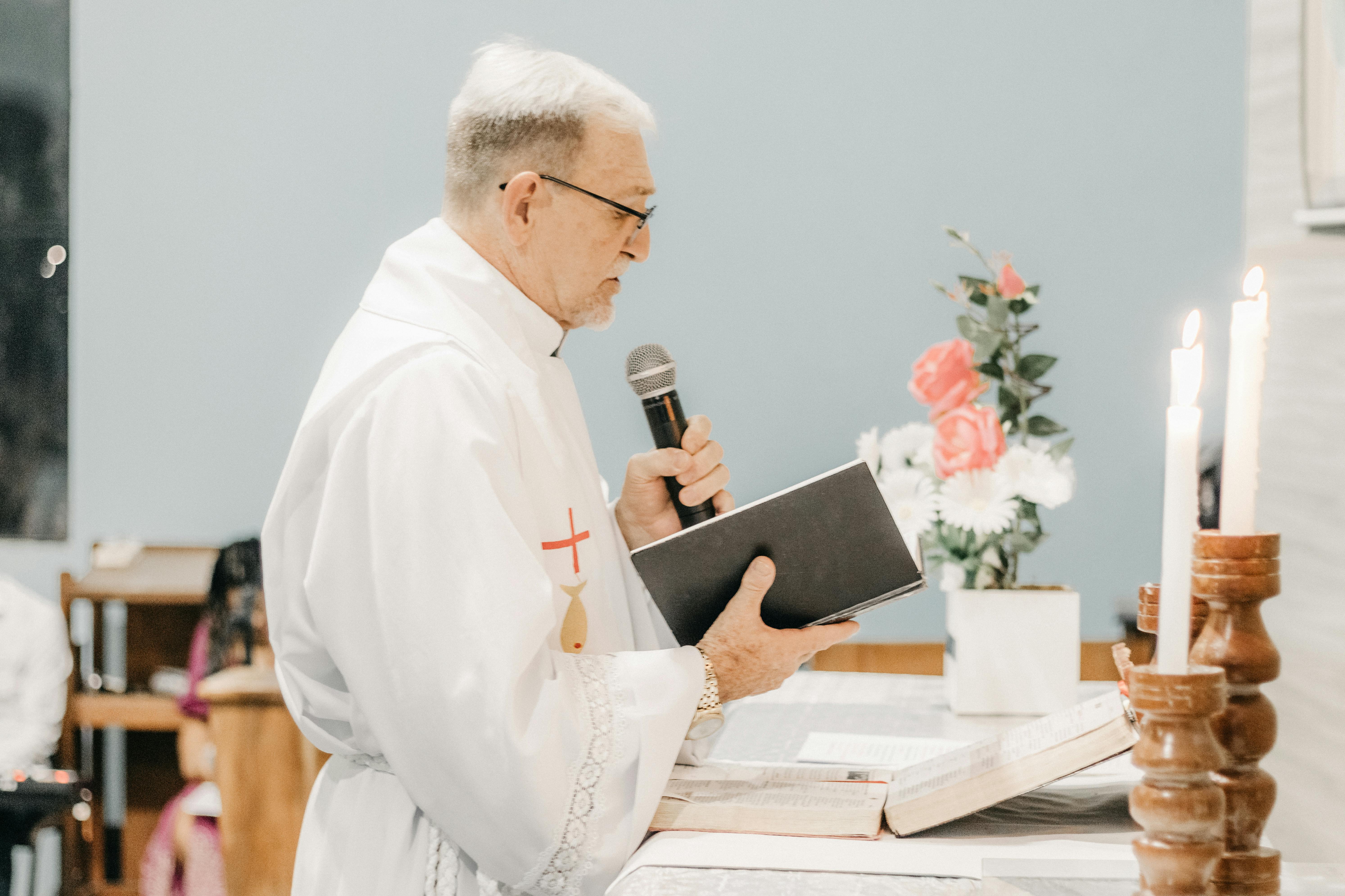 Priest with Microphone at Church · Free Stock Photo