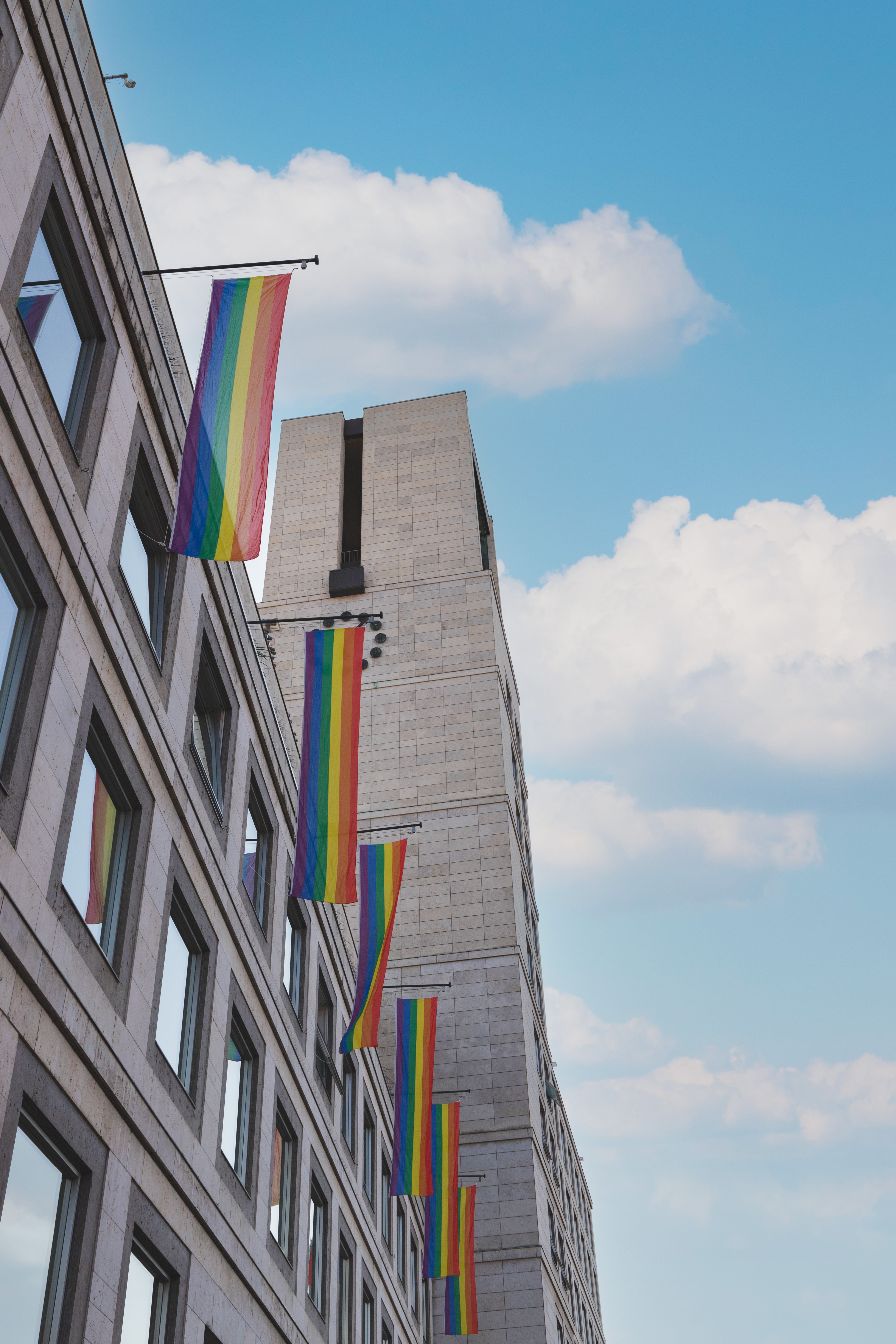 Rainbow Flags Hanging on Stuttgart Town Hall Building · Free Stock Photo