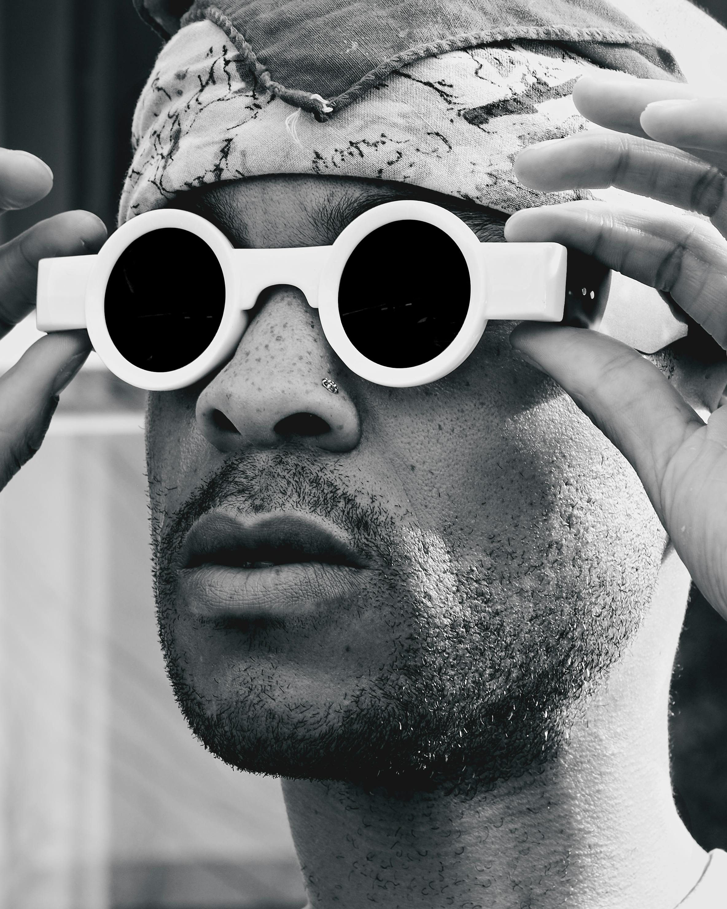 A Black Man With A Hat Doing Graphics Design On Design Temolates Photos ...