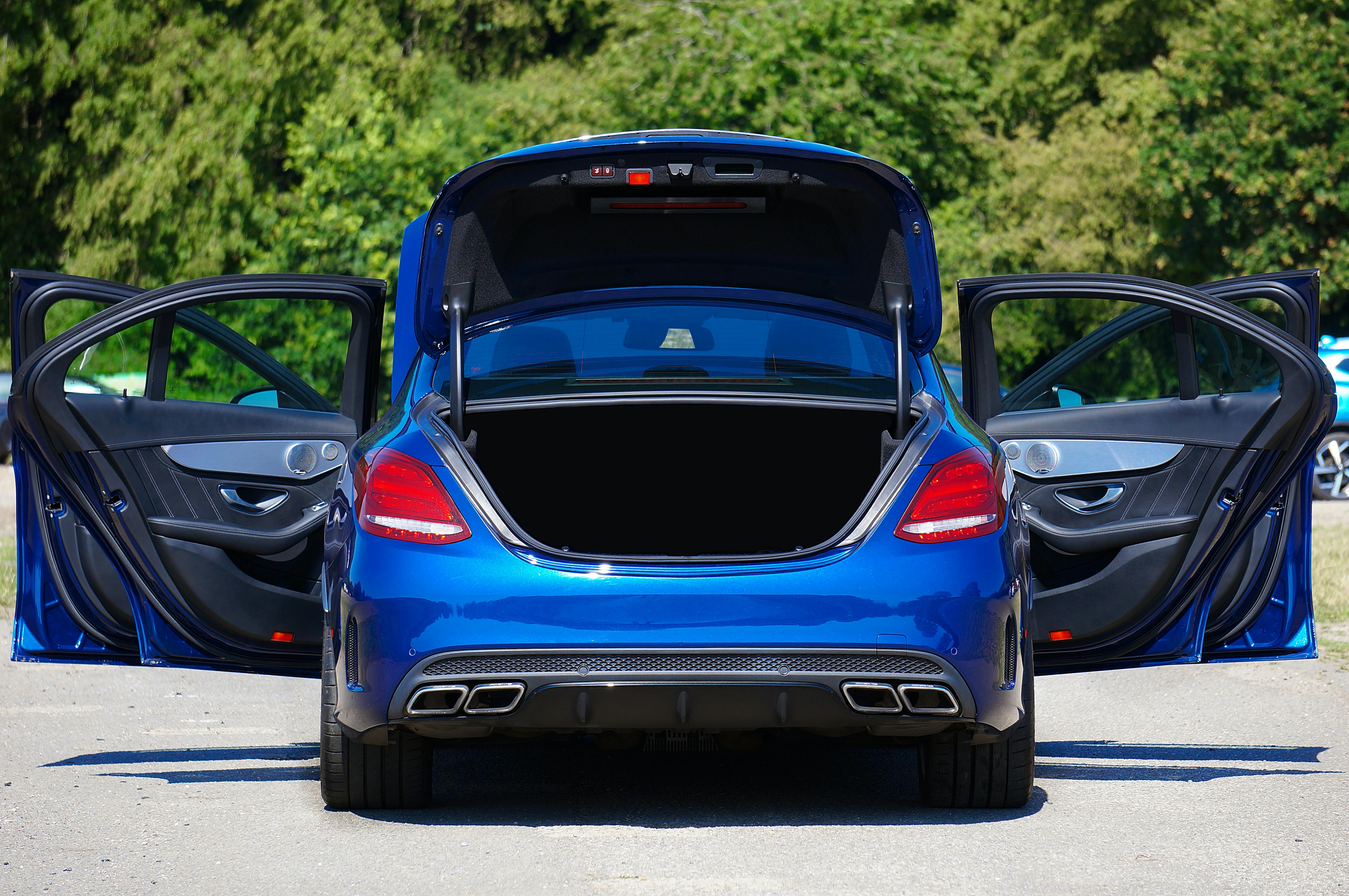 Rear View of a Blue Mercedes-Benz Car with Open Trunk and Doors · Free ...