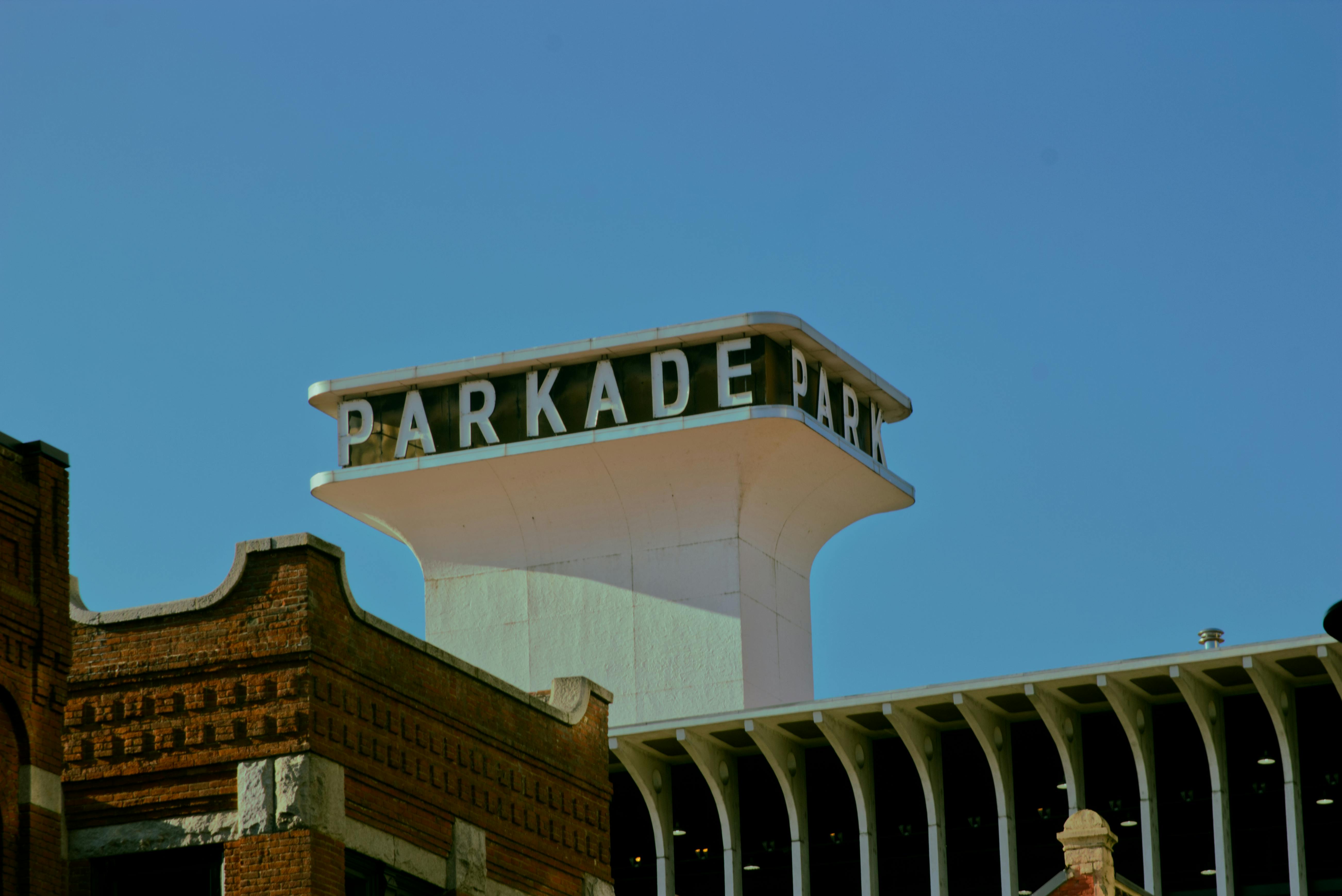 A sign that says parkade on top of a building · Free Stock Photo