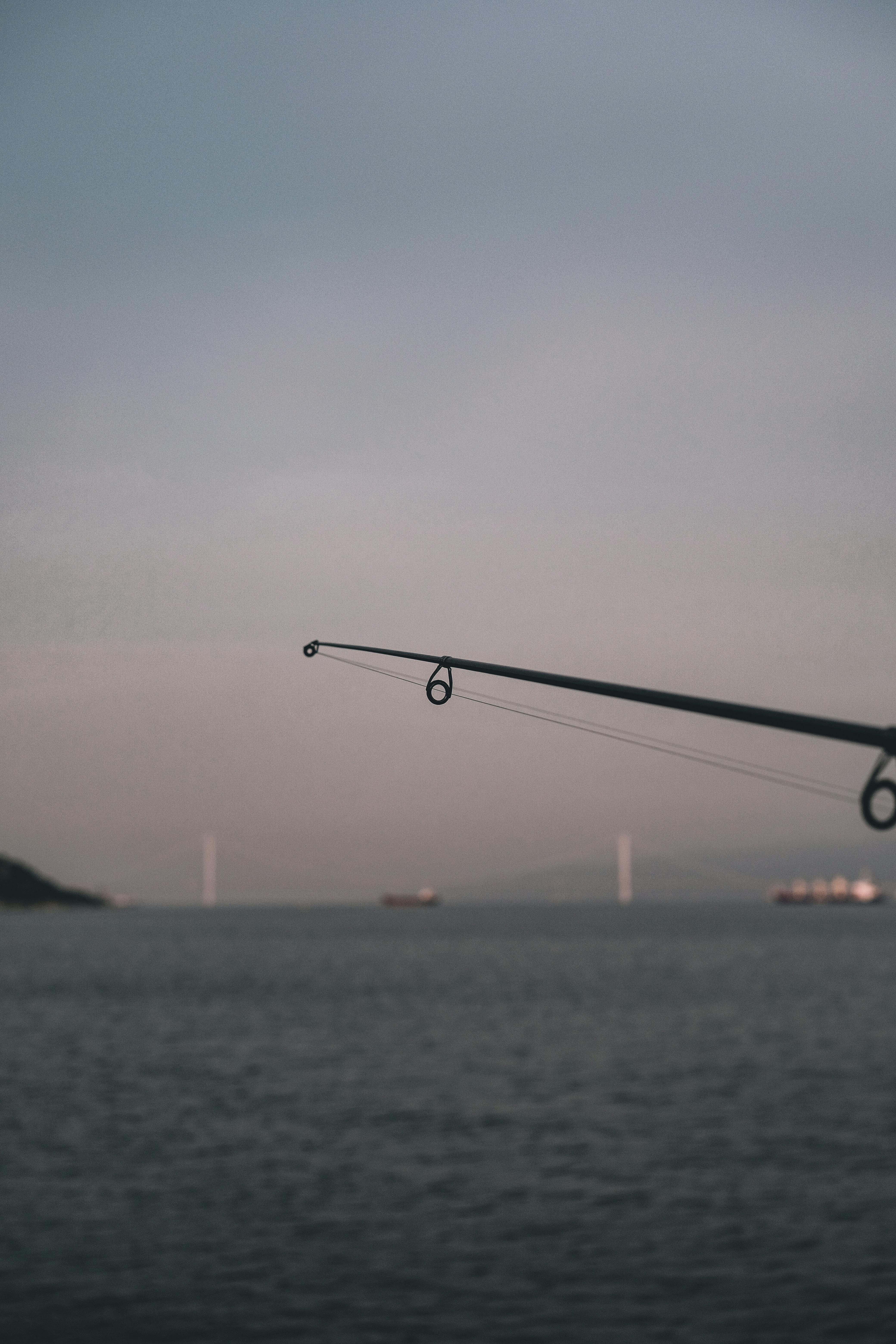 Photo of a Fishing Rod over the Sea · Free Stock Photo