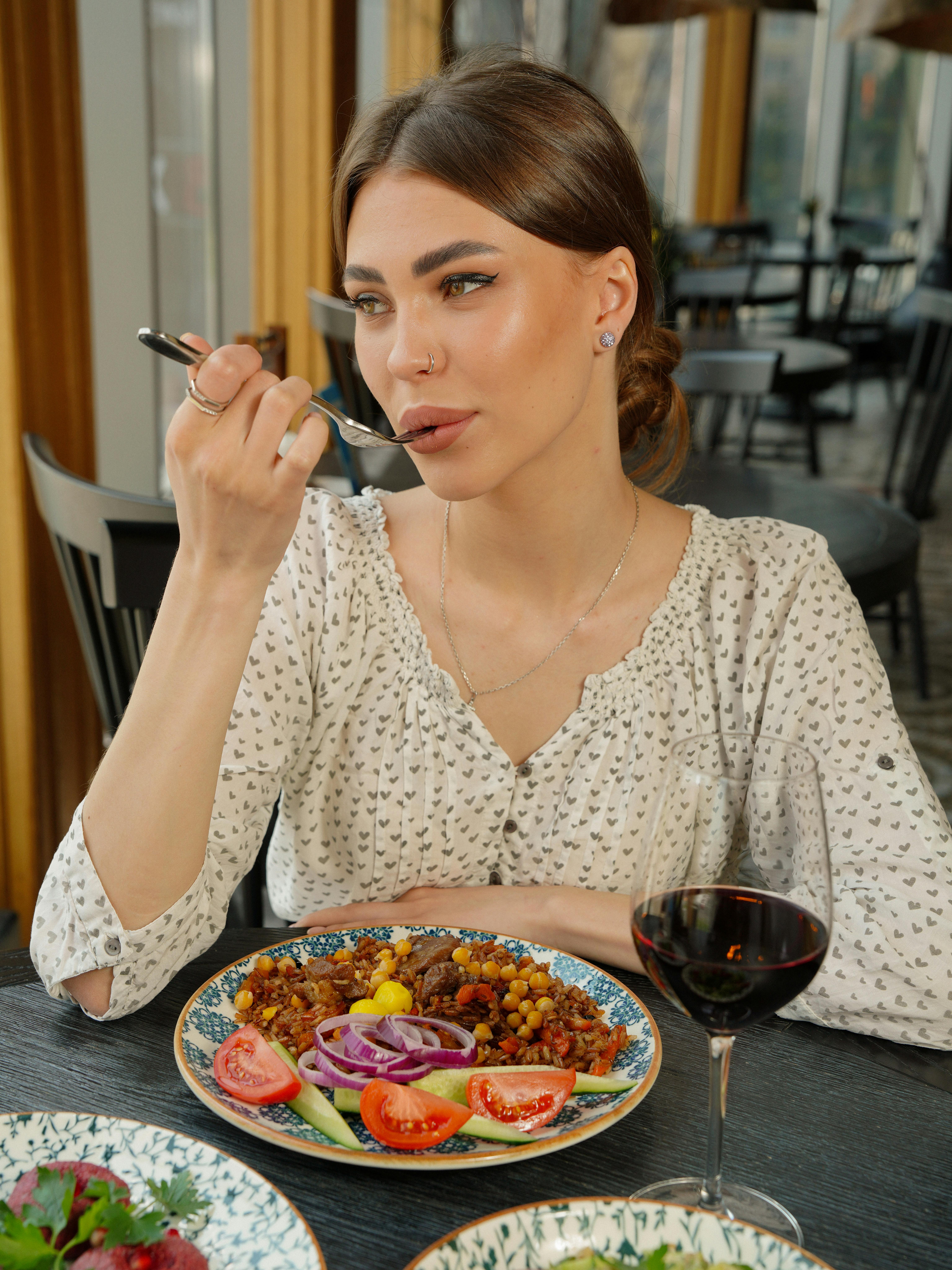 Photo of a Woman Eating a Dinner · Free Stock Photo