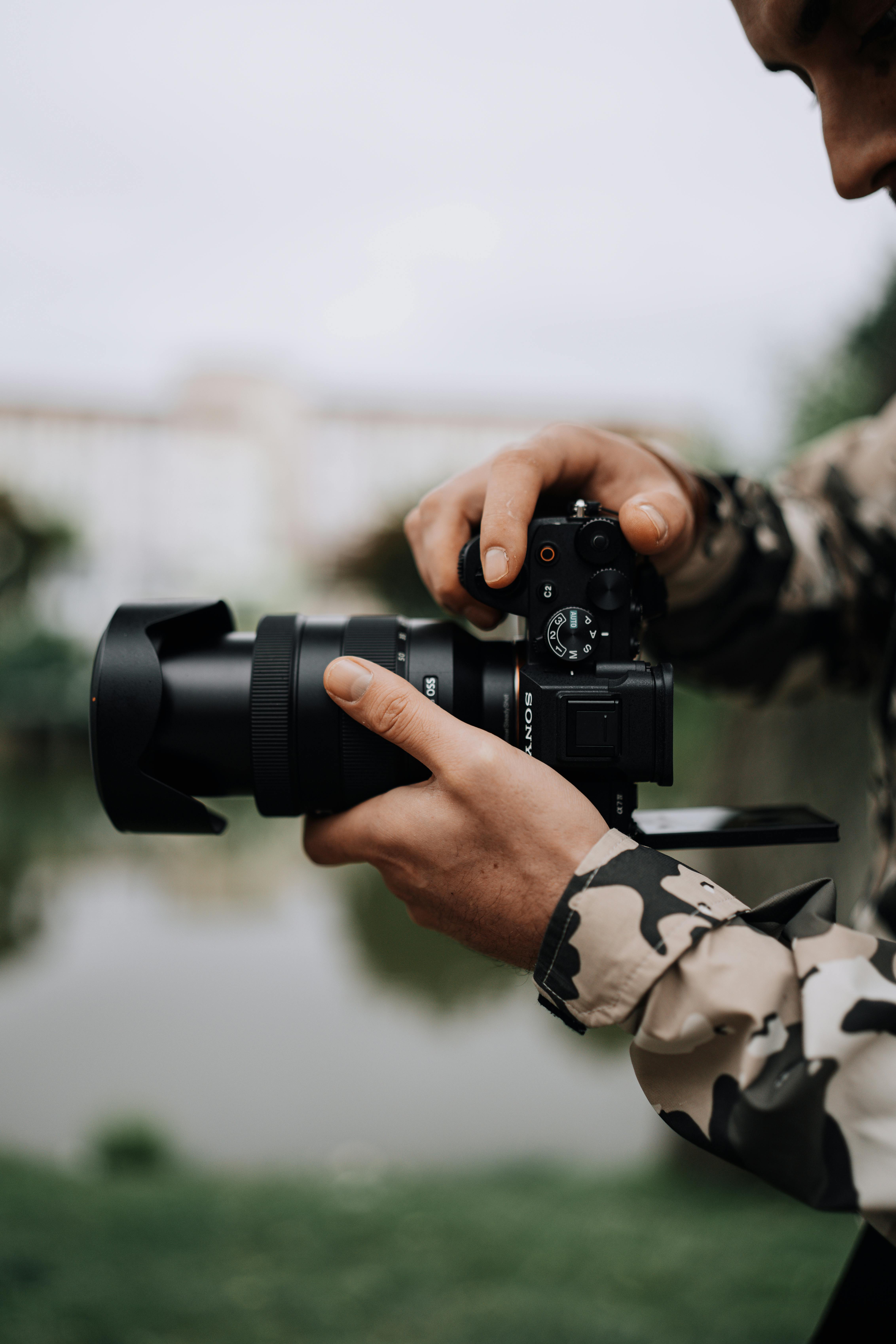 Woman Using Slr Camera · Free Stock Photo