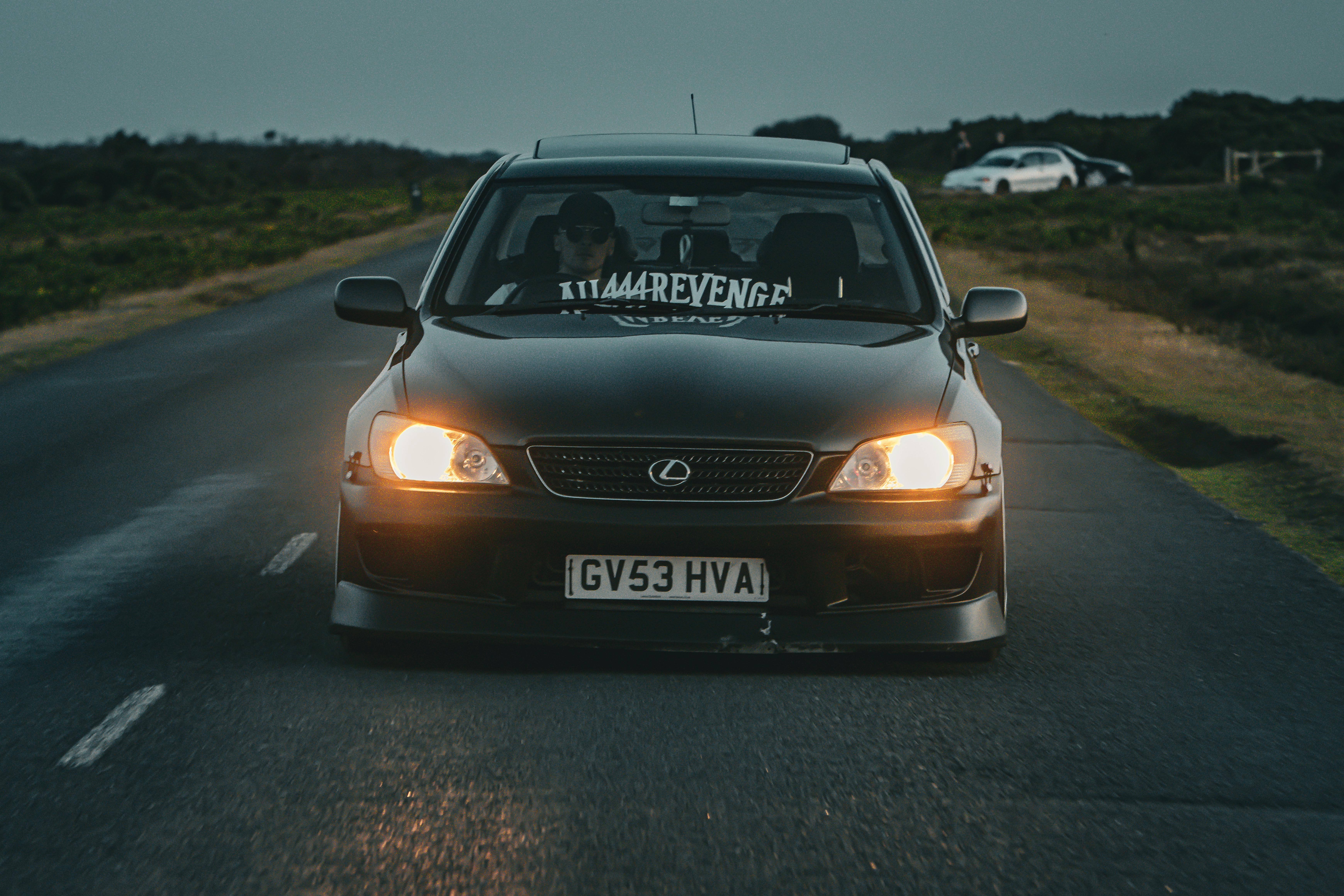 A Modified Black Lexus IS200 on the Street · Free Stock Photo