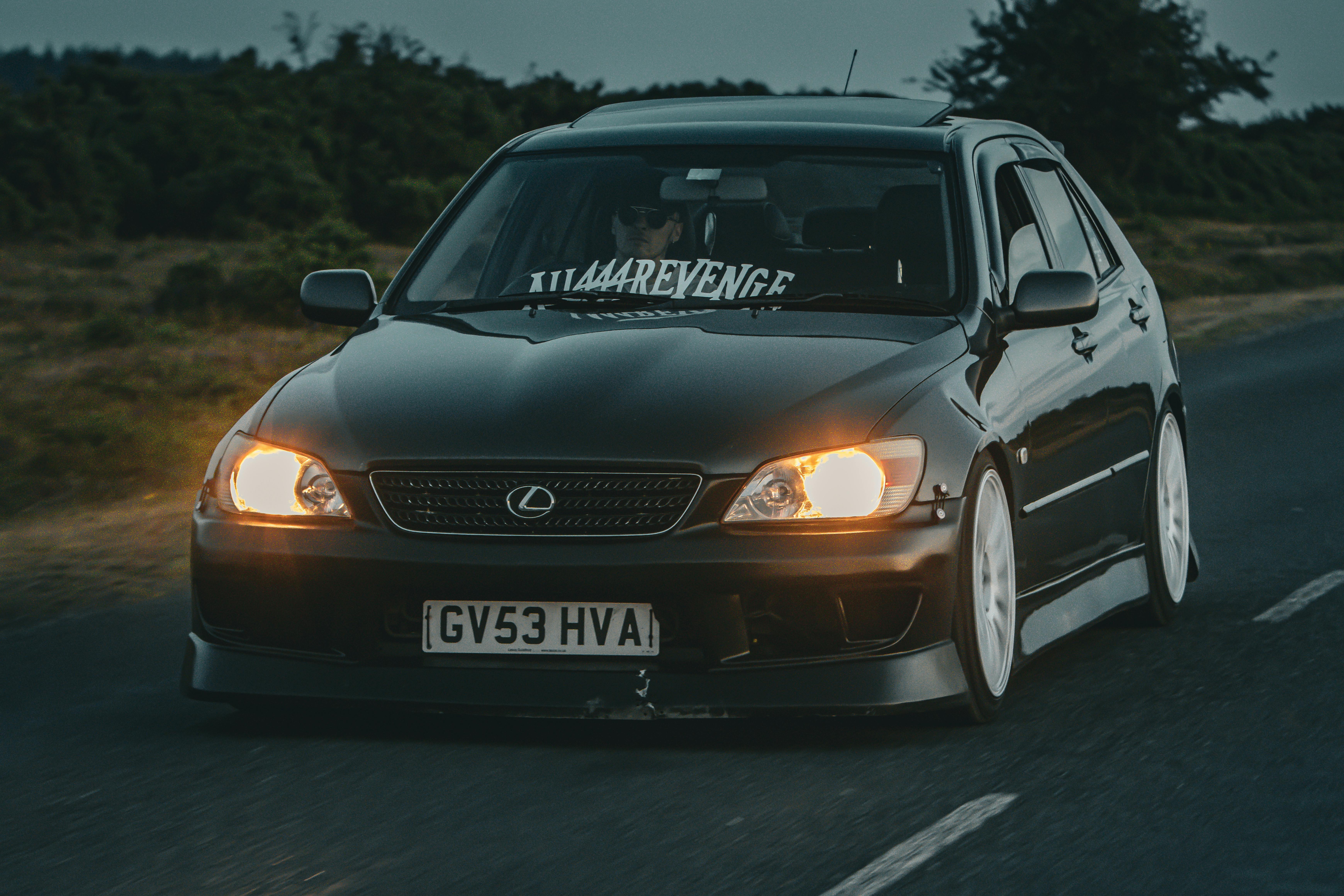 A Modified Black Lexus IS200 on the Street · Free Stock Photo