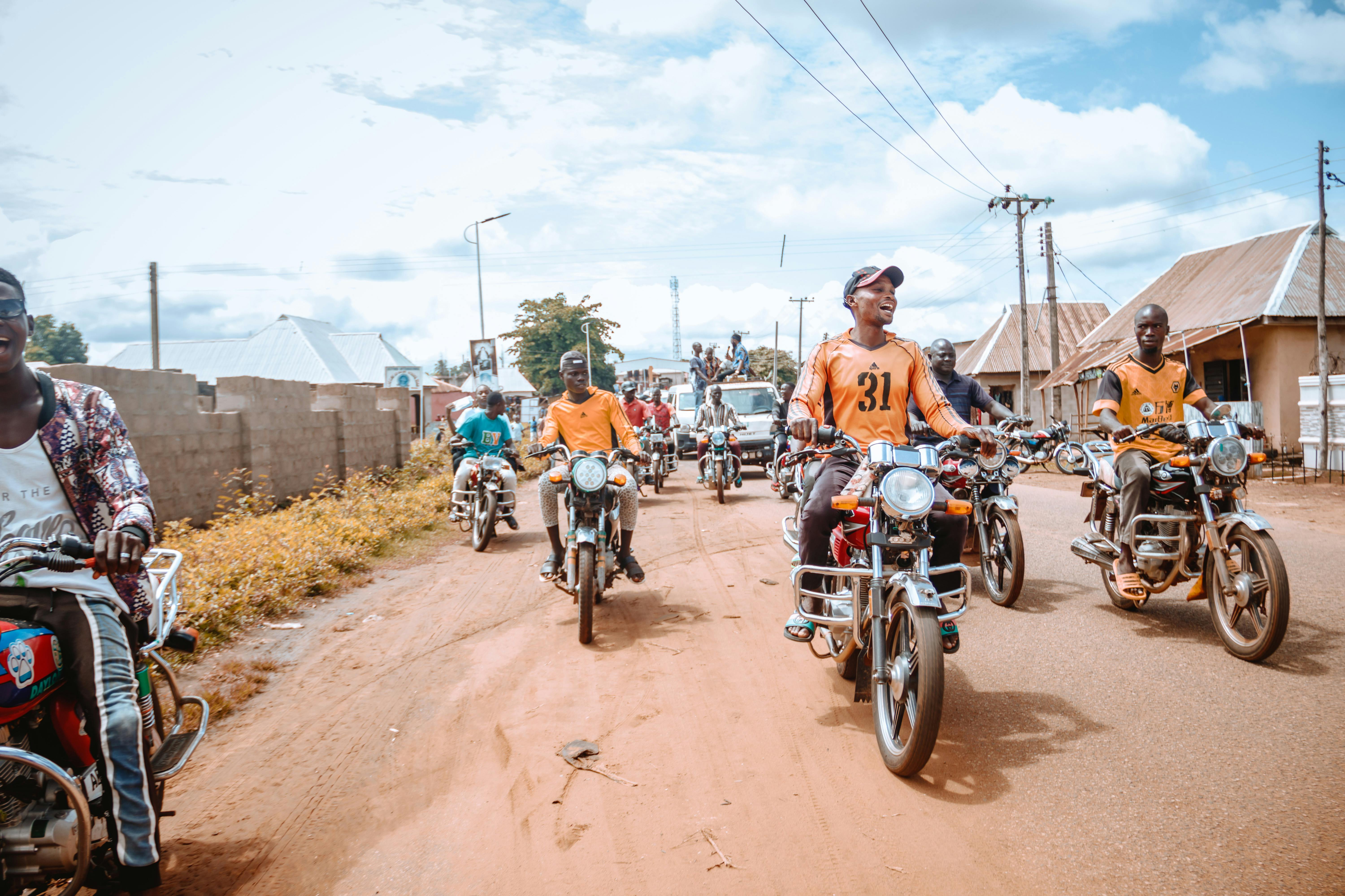 Man Riding Motorbike in Village · Free Stock Photo