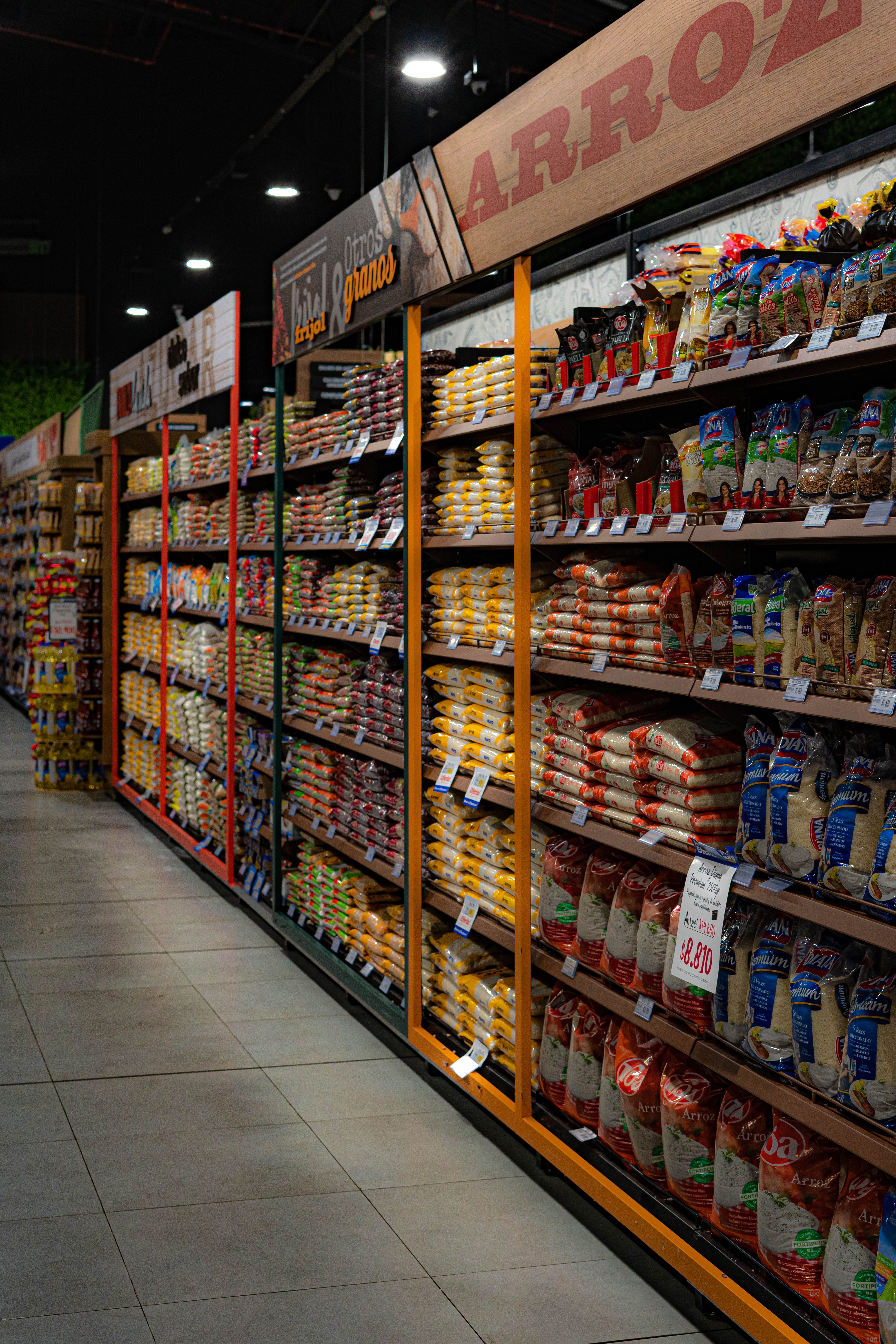 Well-Stocked Grocery Store Aisle with Rice and Grains · Free Stock Photo