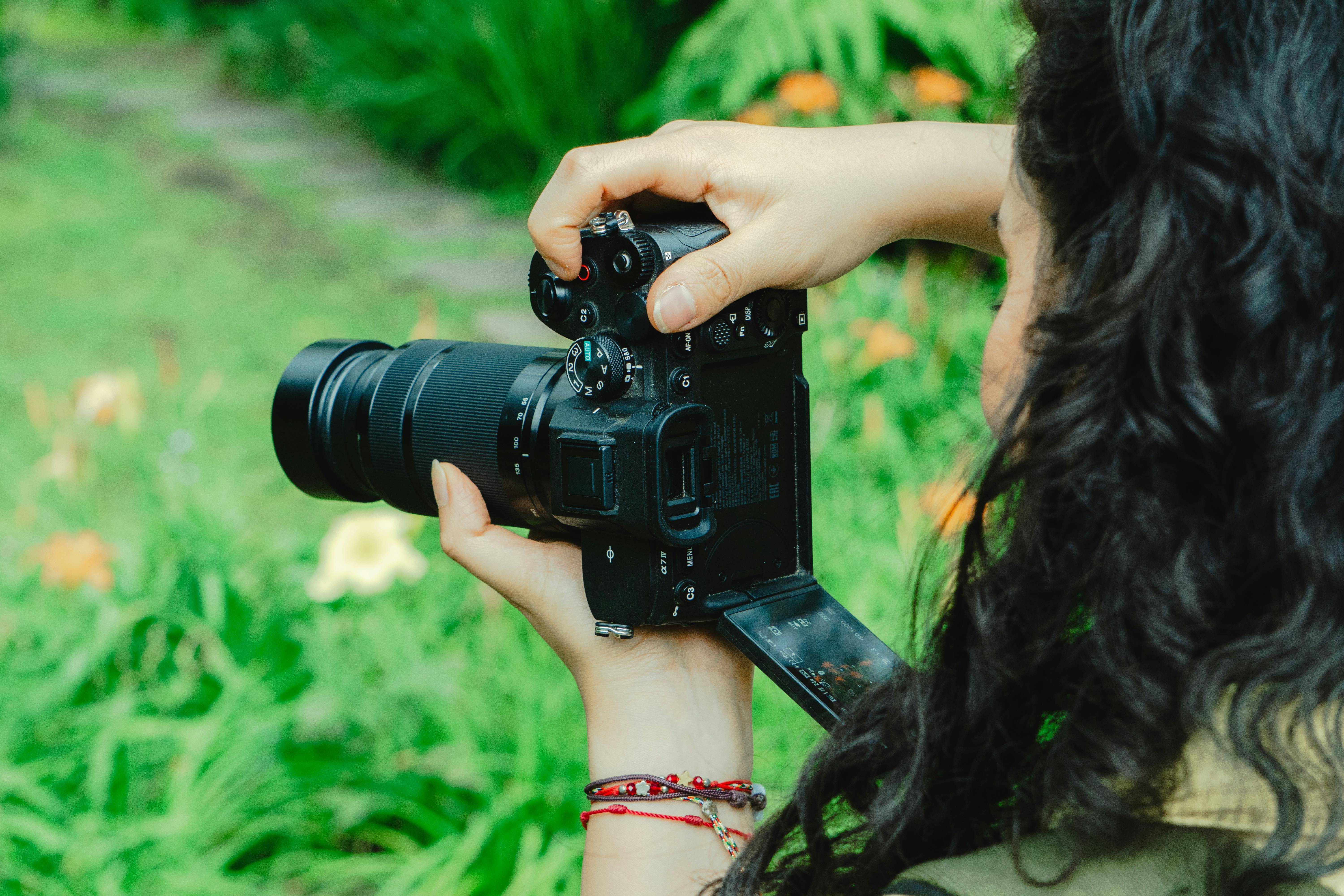 Woman Taking Pictures with Camera · Free Stock Photo