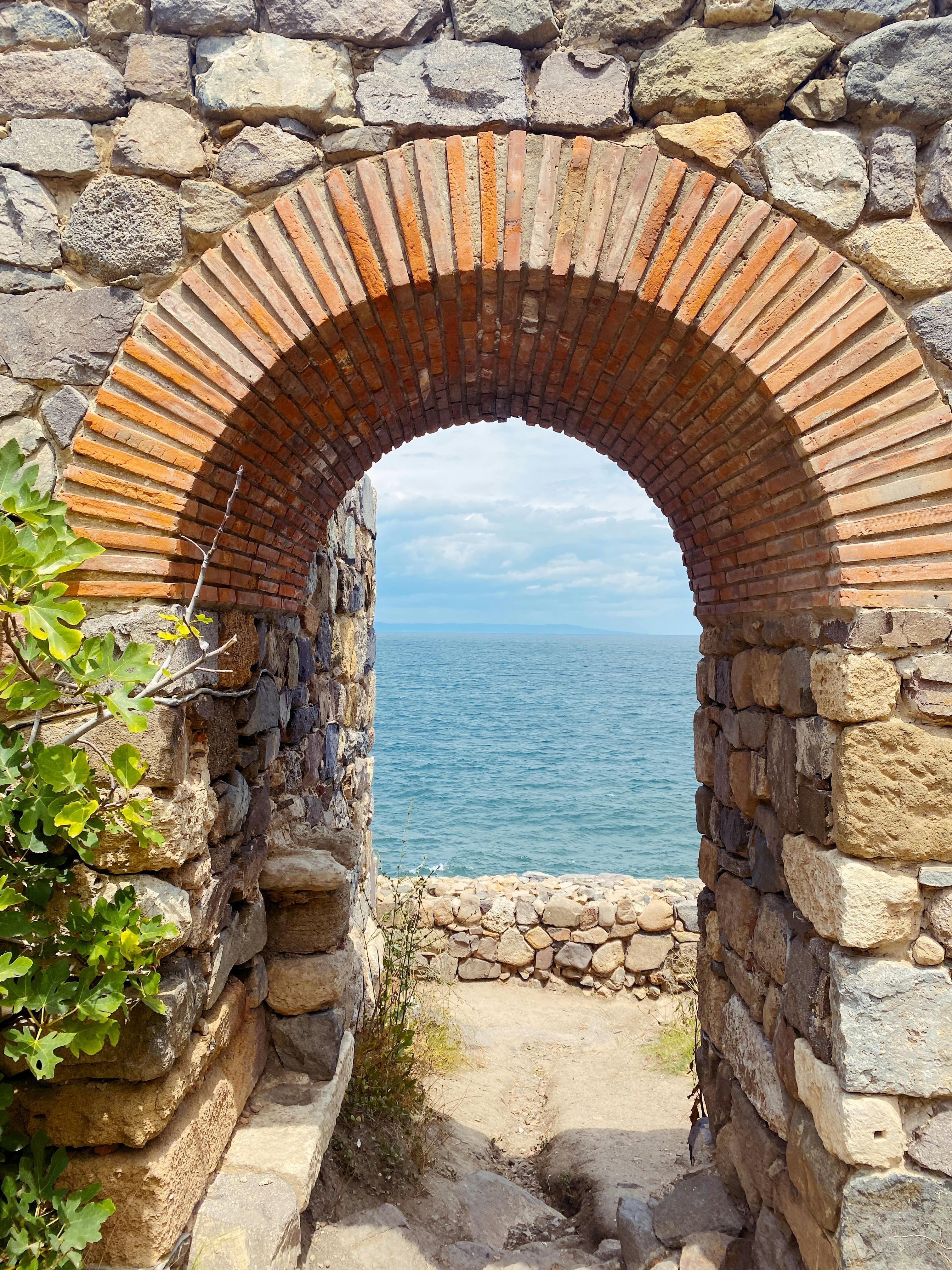 Steel Gate of Brown Brick Building · Free Stock Photo