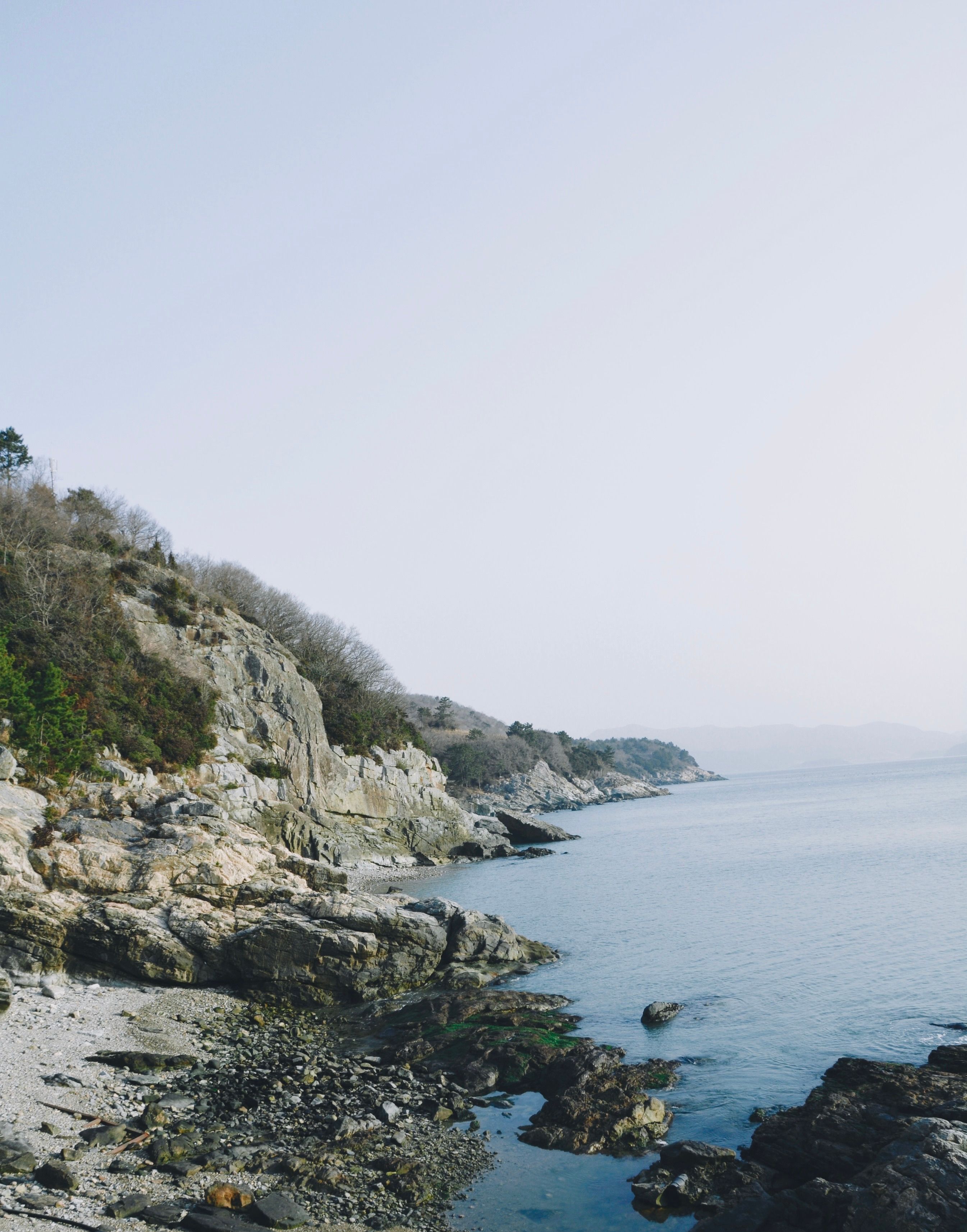 Water around Rocks on Sea Shore · Free Stock Photo